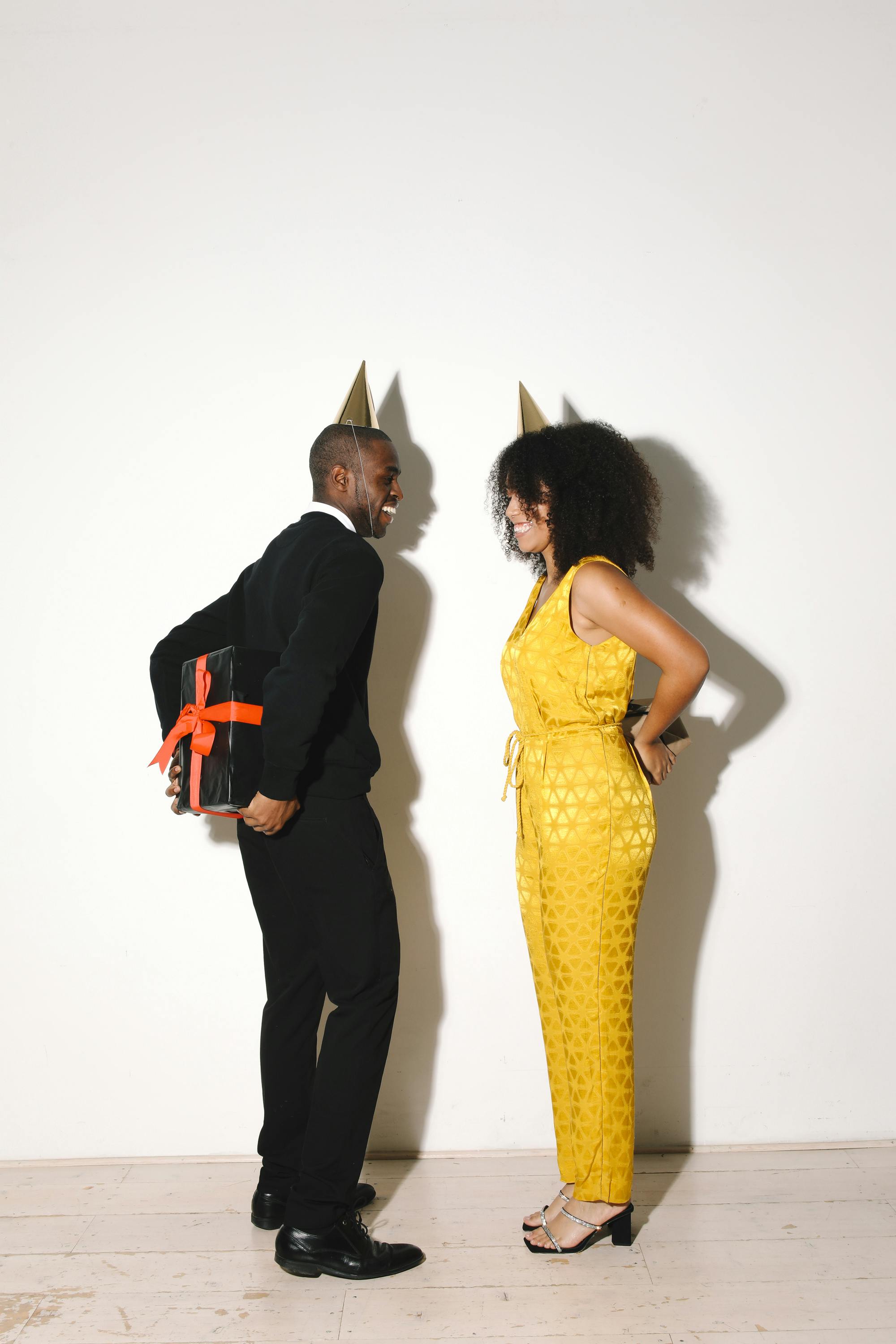 A Couple Hiding Their Gifts behind Their Back · Free Stock Photo