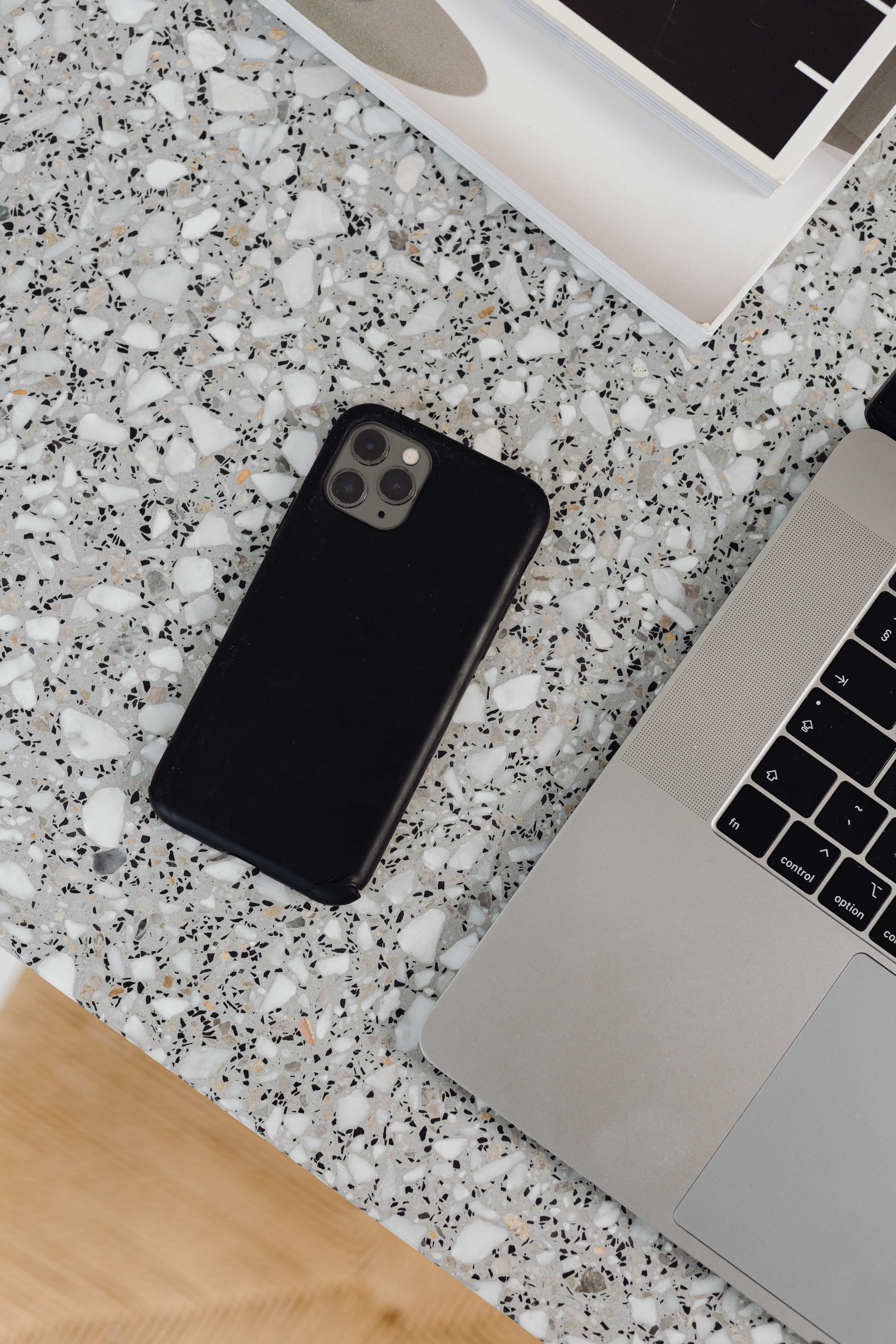 Black Mobile Phone on Marble Table · Free Stock Photo