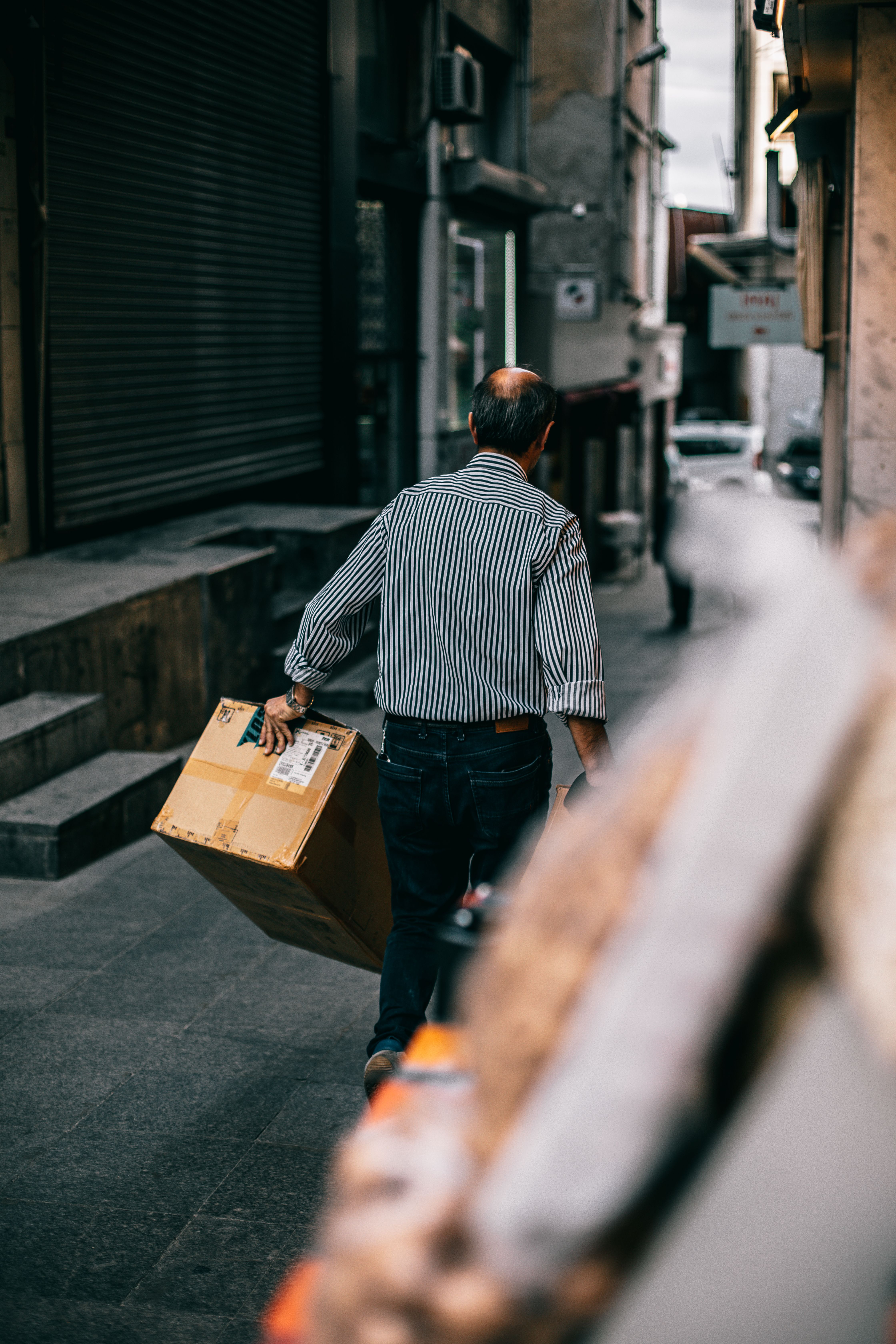 A Man Walking on the Street · Free Stock Photo
