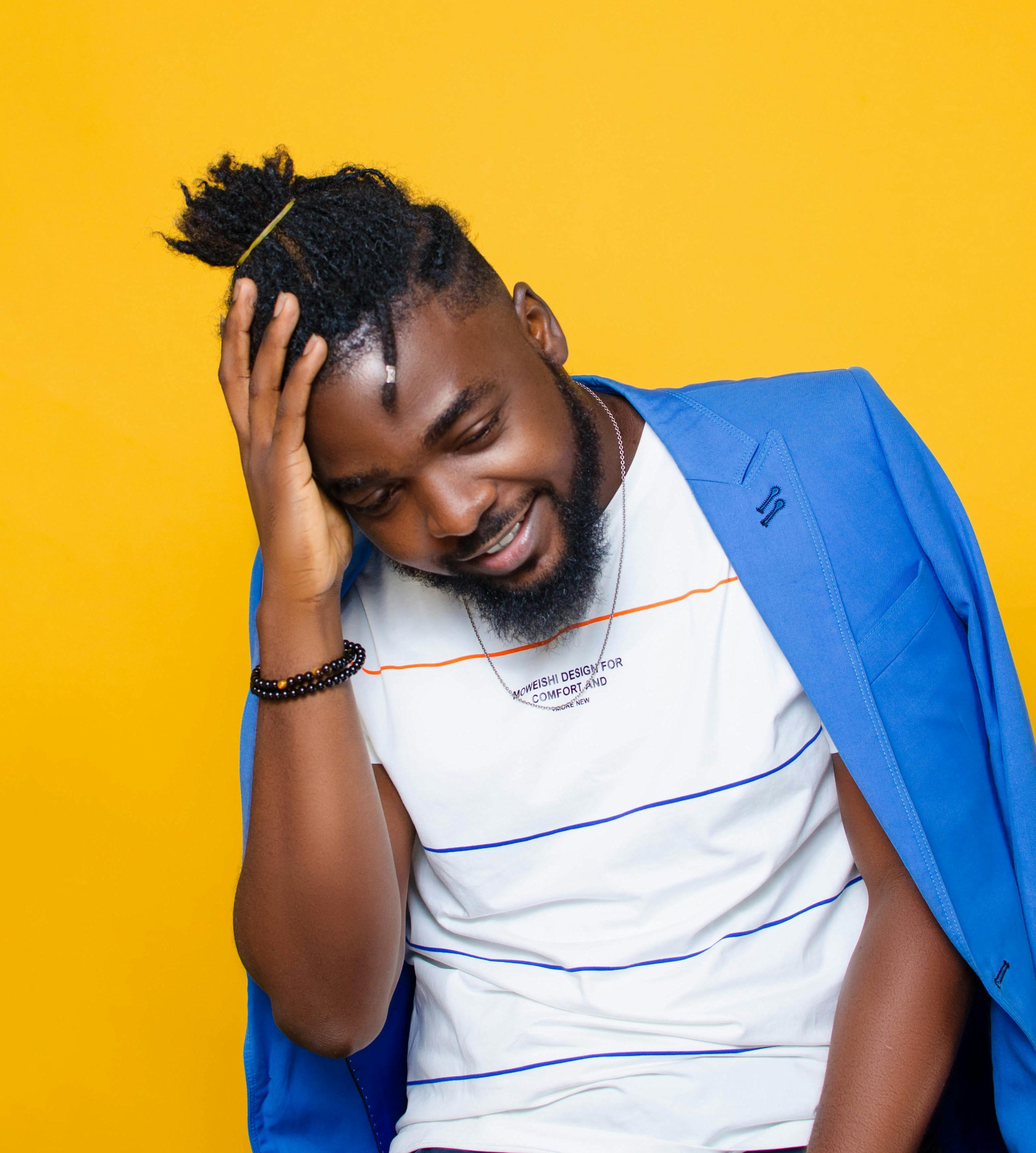 A Man Posing with a Frame · Free Stock Photo