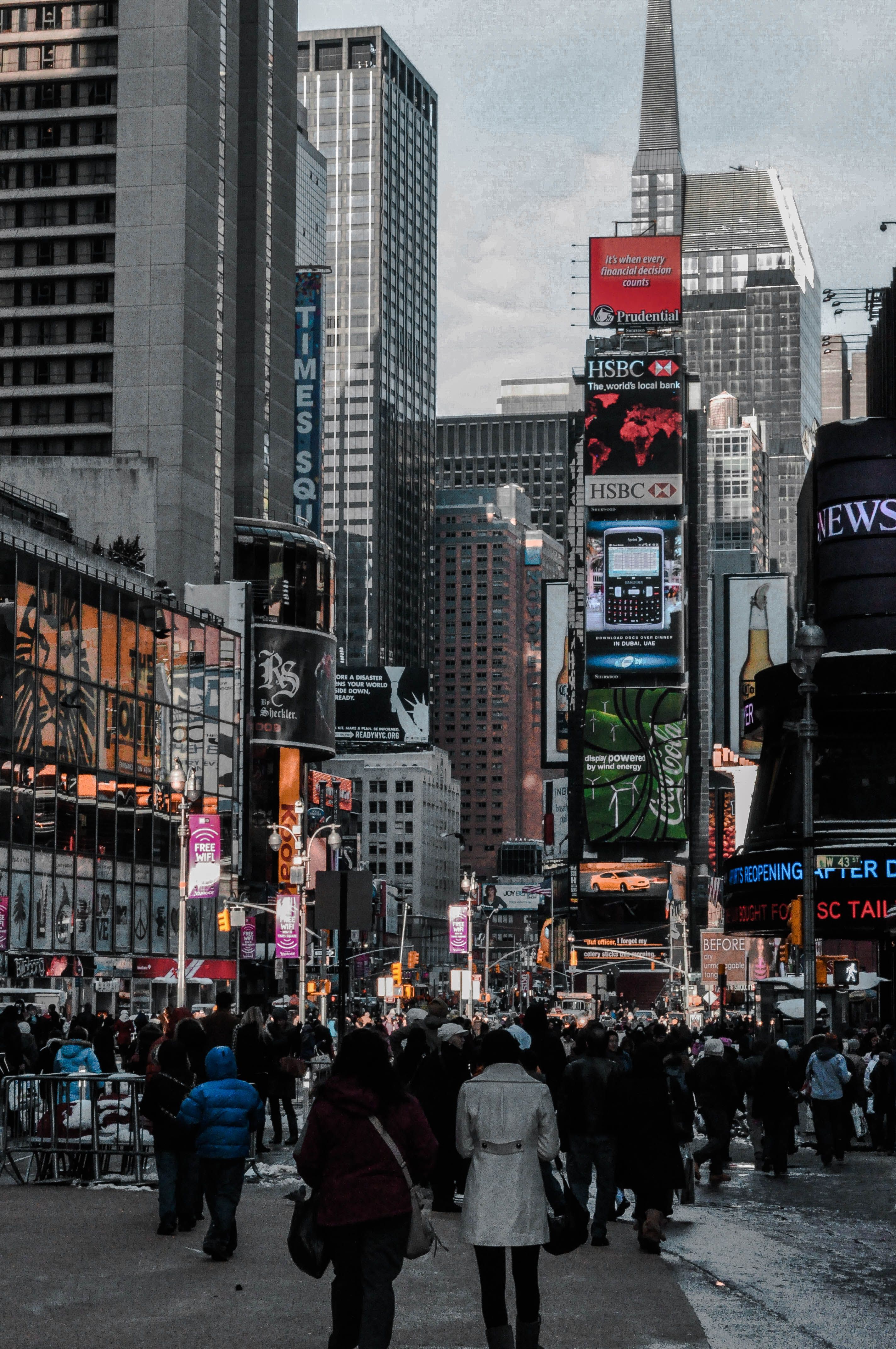 People Walking on the Street Between City Buildings · Free Stock Photo