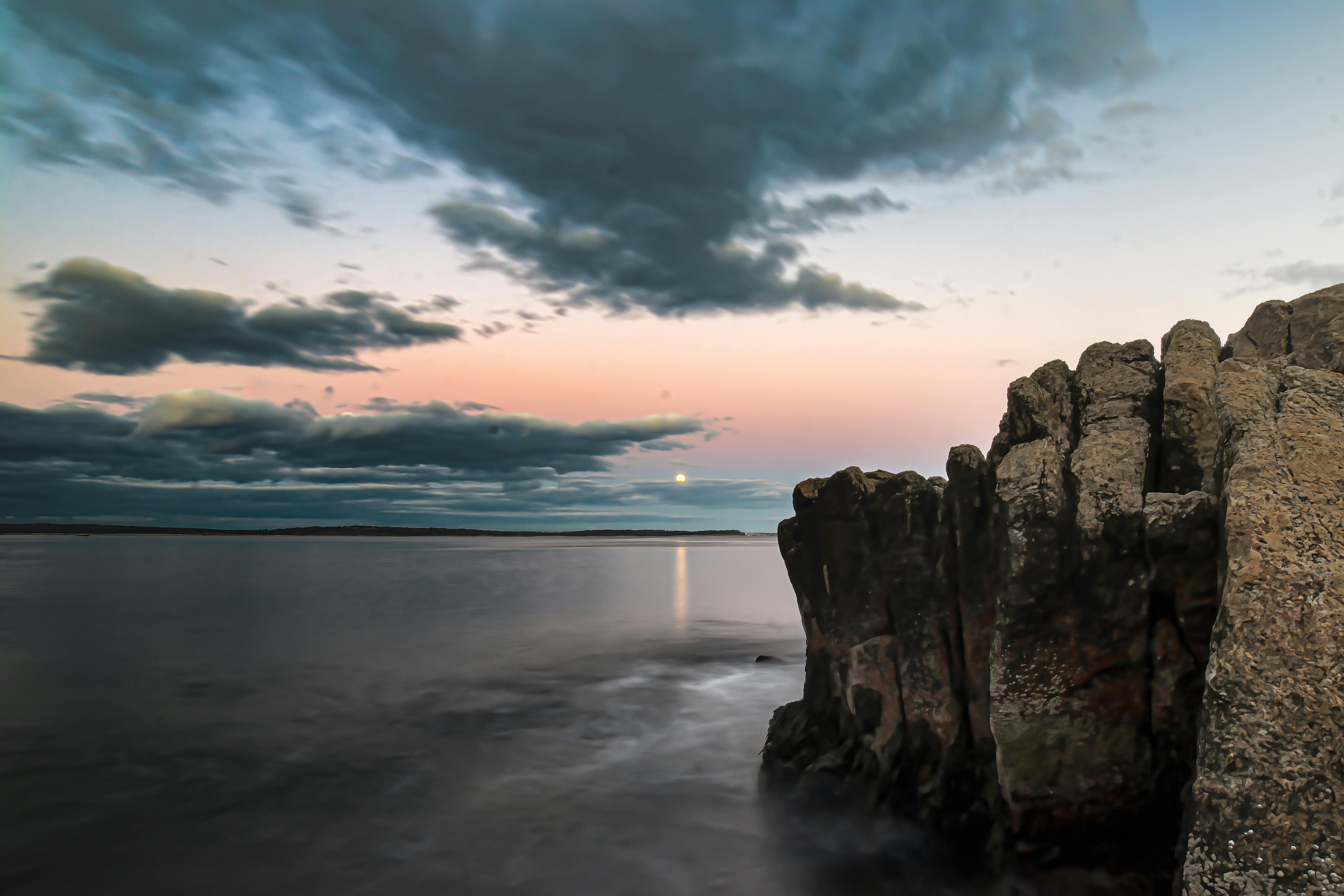 Rock Formation on Sea during Dawn · Free Stock Photo