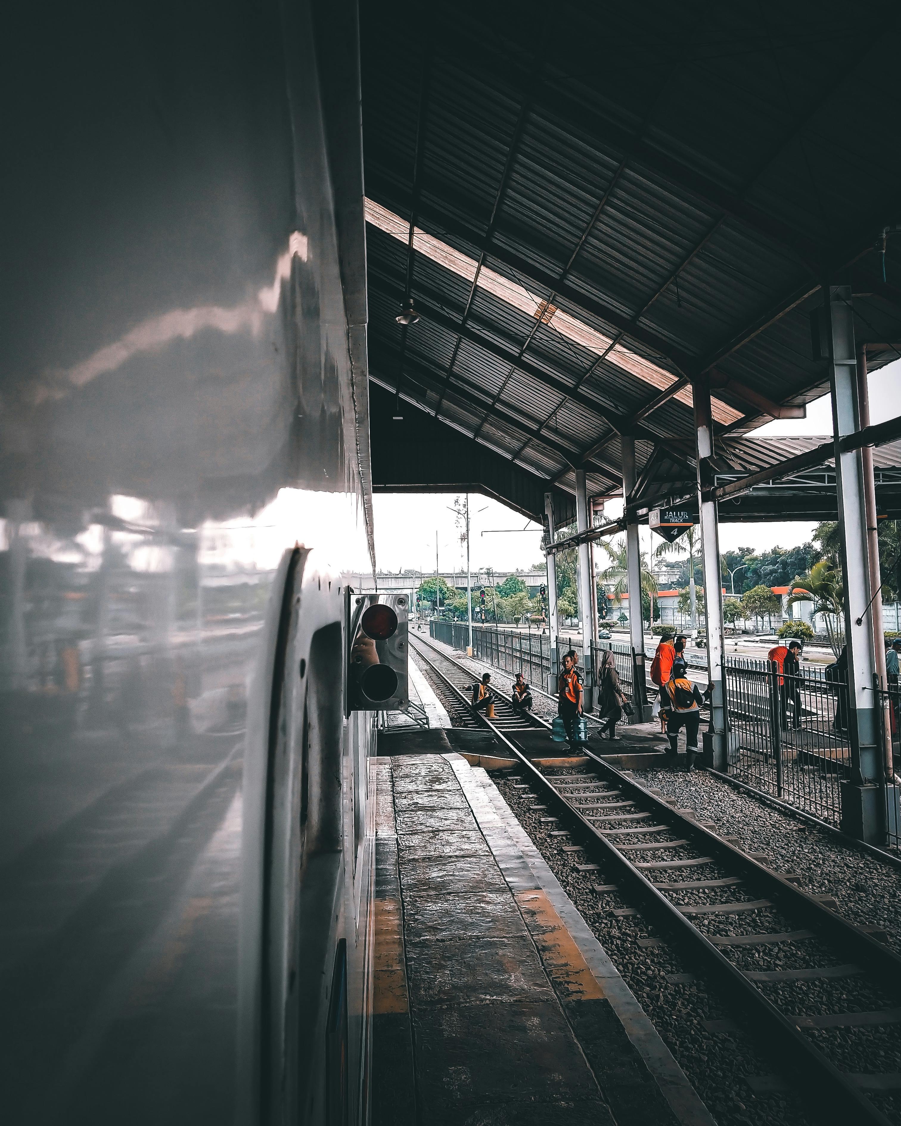 People Standing on Railroad Track · Free Stock Photo