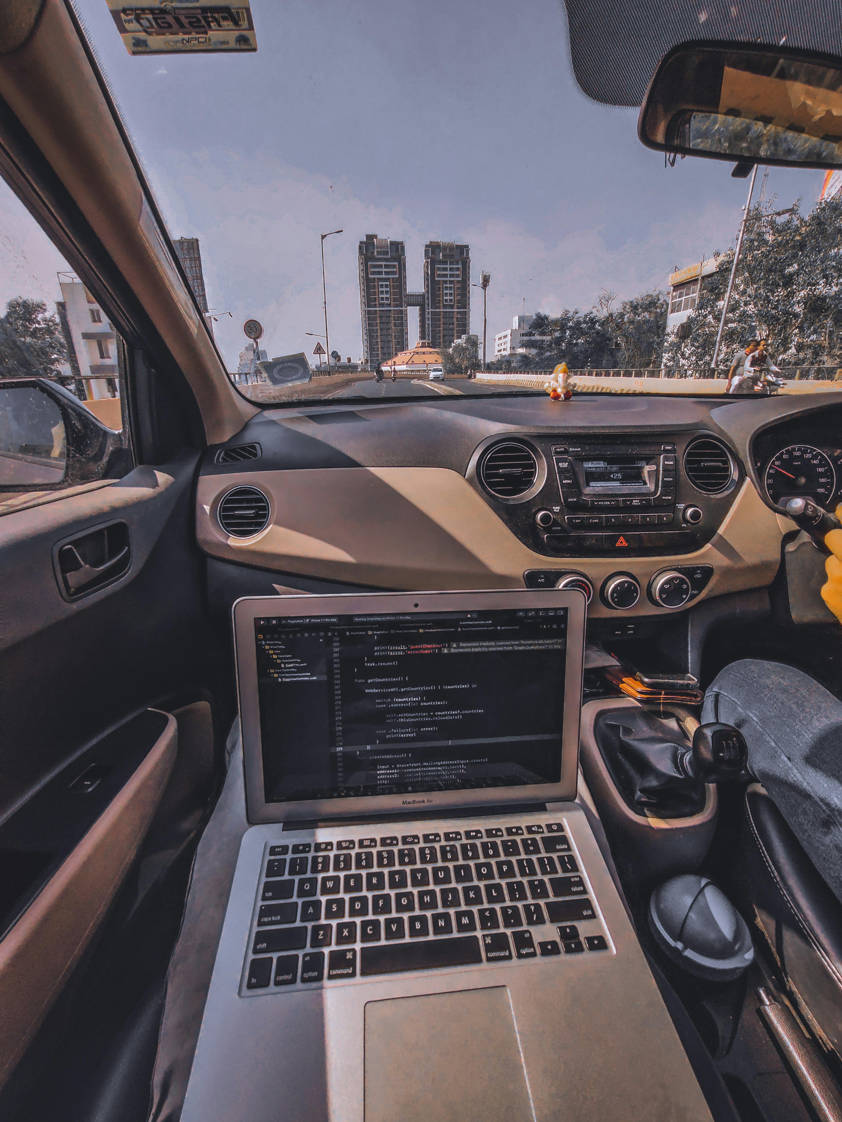 Computer Laptop on Car Passenger Seat · Free Stock Photo