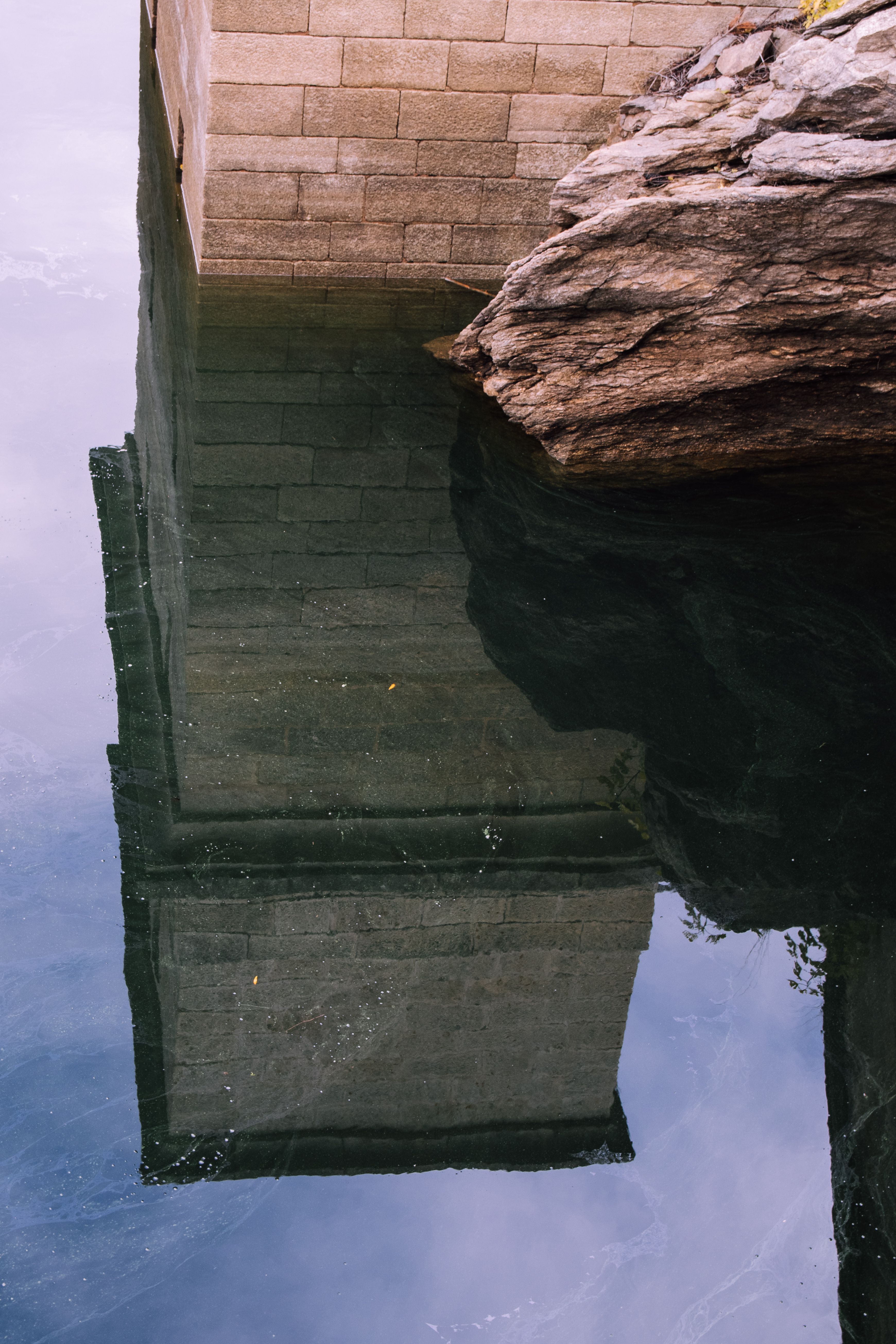 Top View of River Flowing through a Water Dam · Free Stock Photo