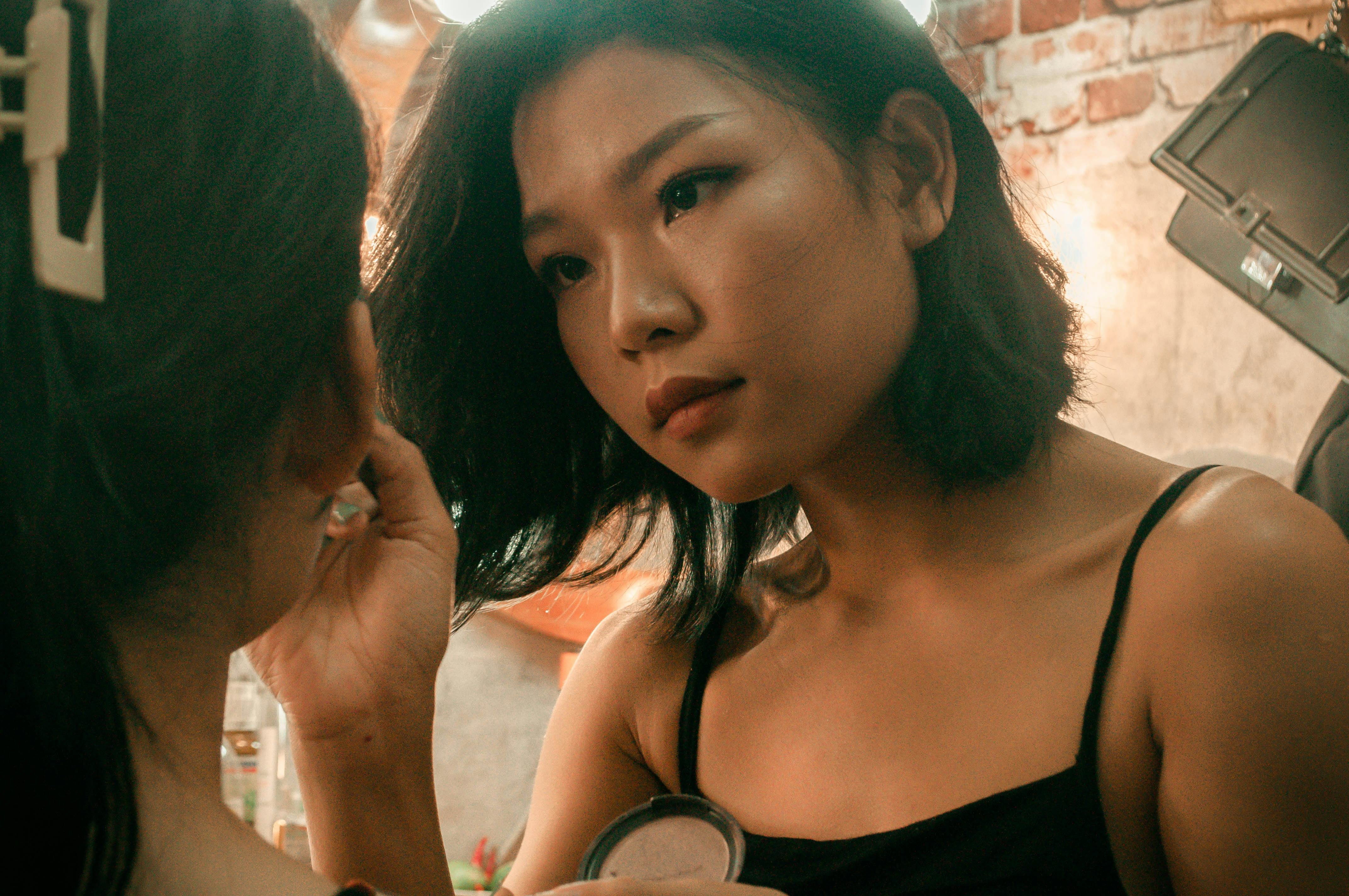 Portrait of Woman with Short Hair and Earrings · Free Stock Photo