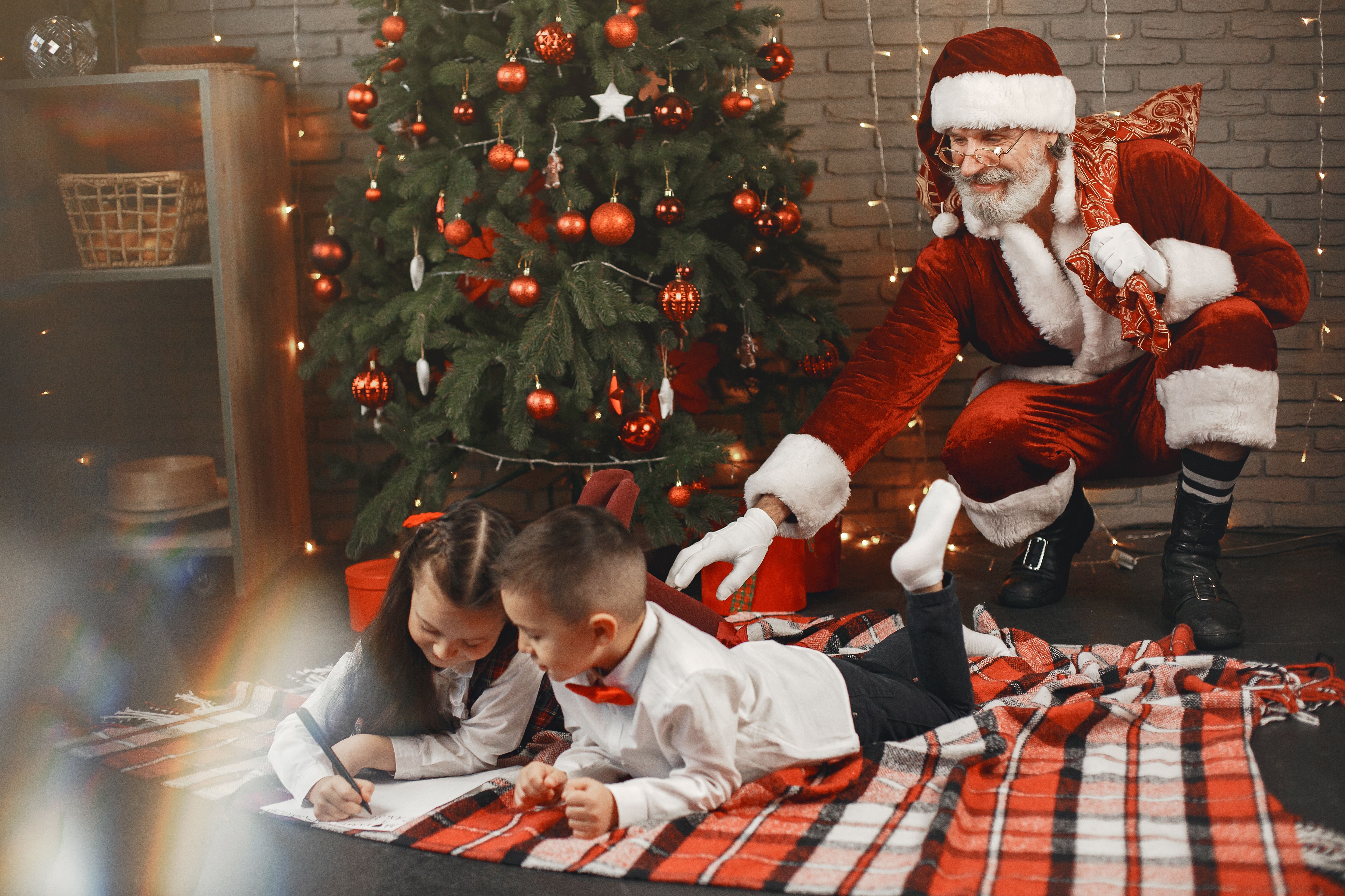 Girl and Boy With Santa Claus · Free Stock Photo