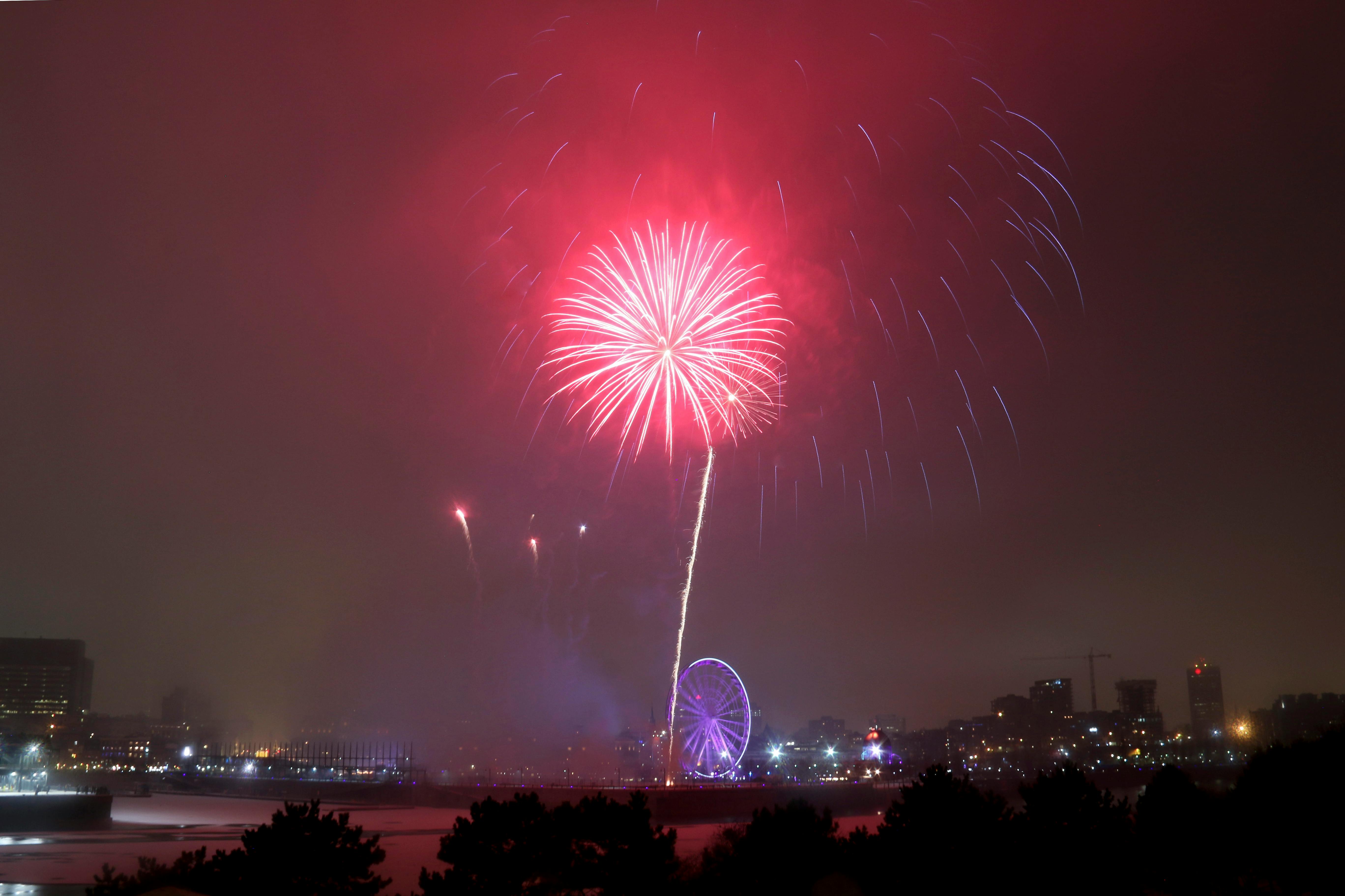 Firework Display Over a City · Free Stock Photo