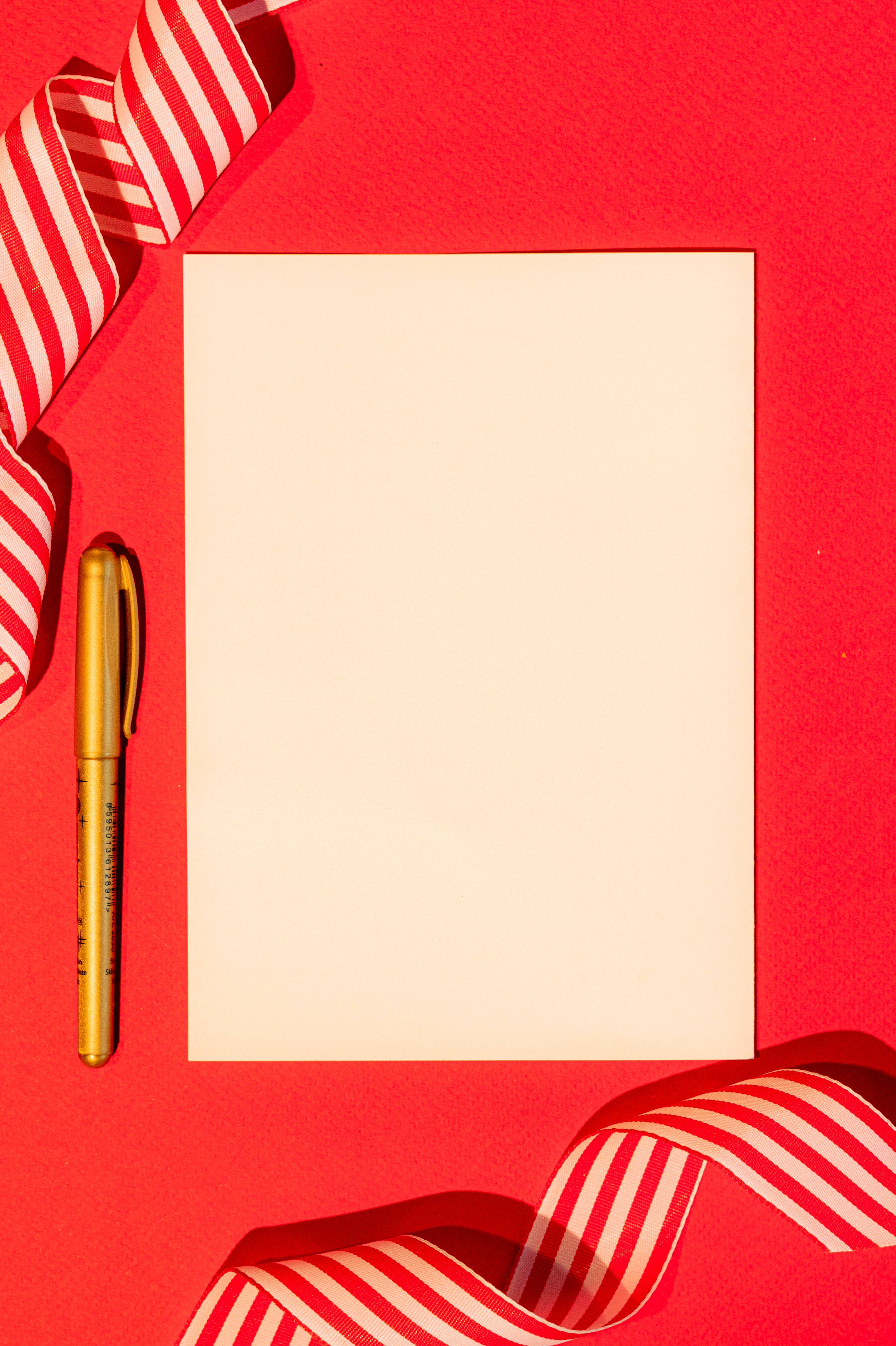 White Printer Paper on Red Table · Free Stock Photo
