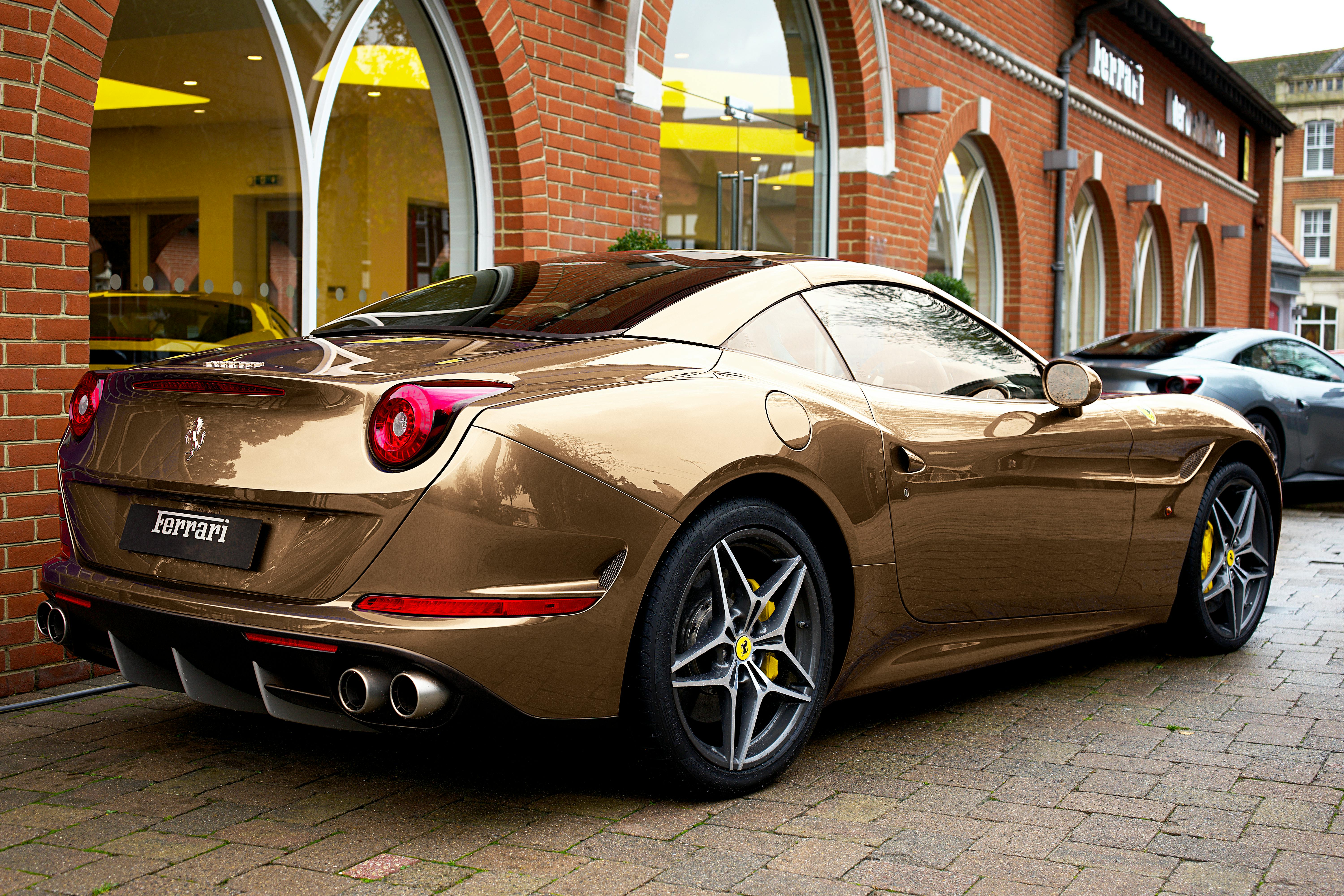 A Ferrari Sports Car Parked Outside · Free Stock Photo