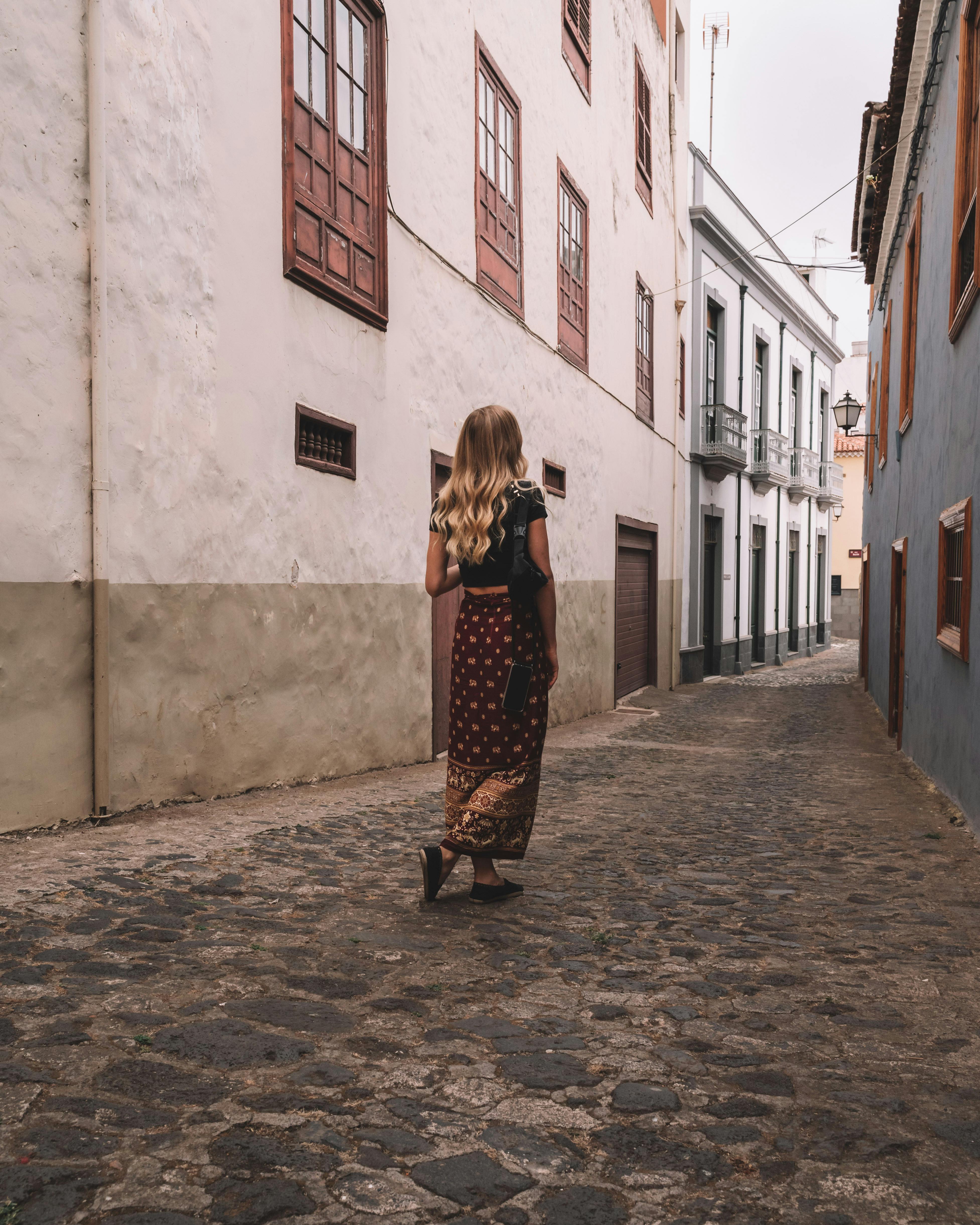 People Standing and Sitting at the Open Park Near Buildings · Free ...