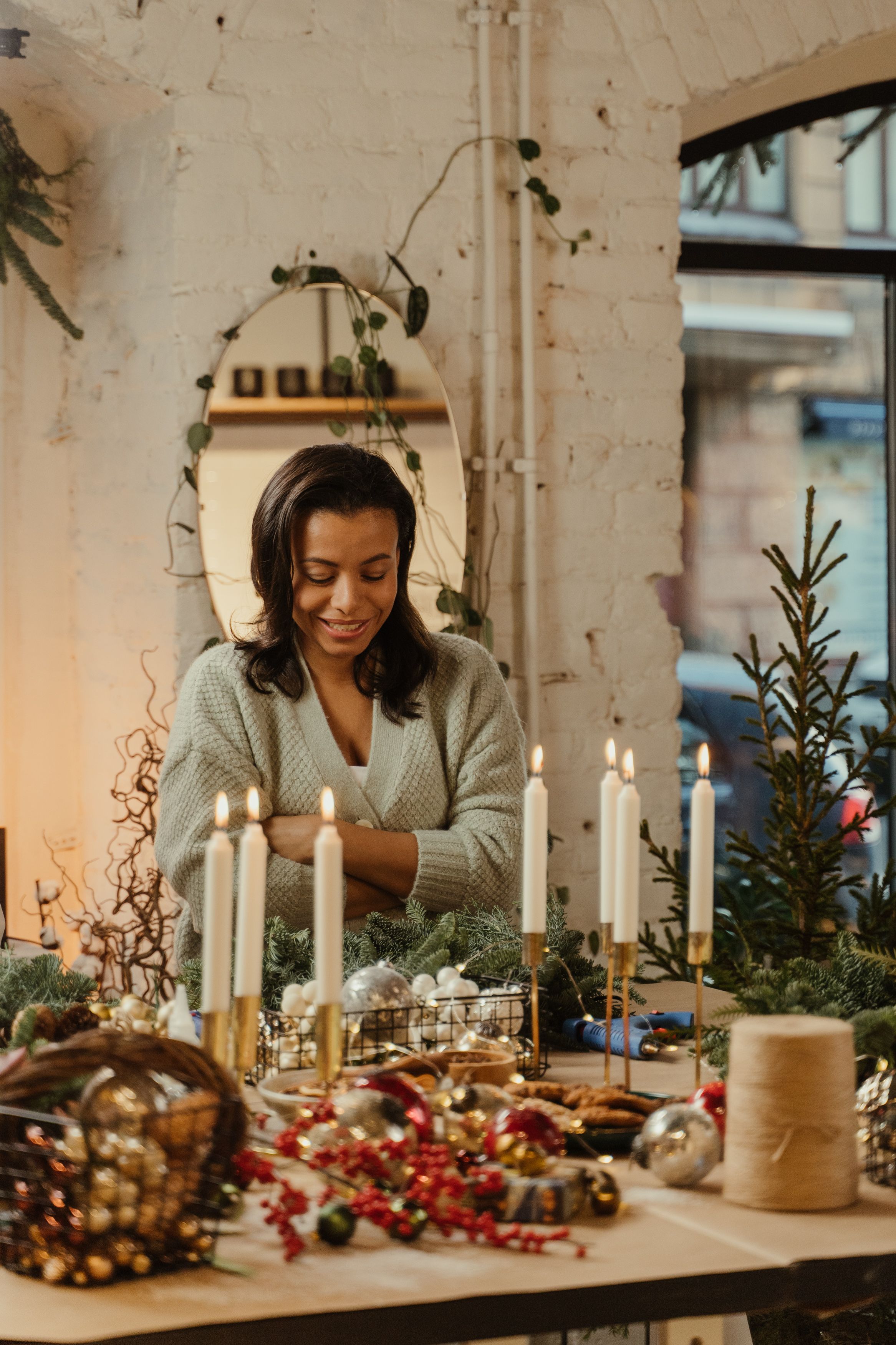 A Woman Standing at the Table · Free Stock Photo