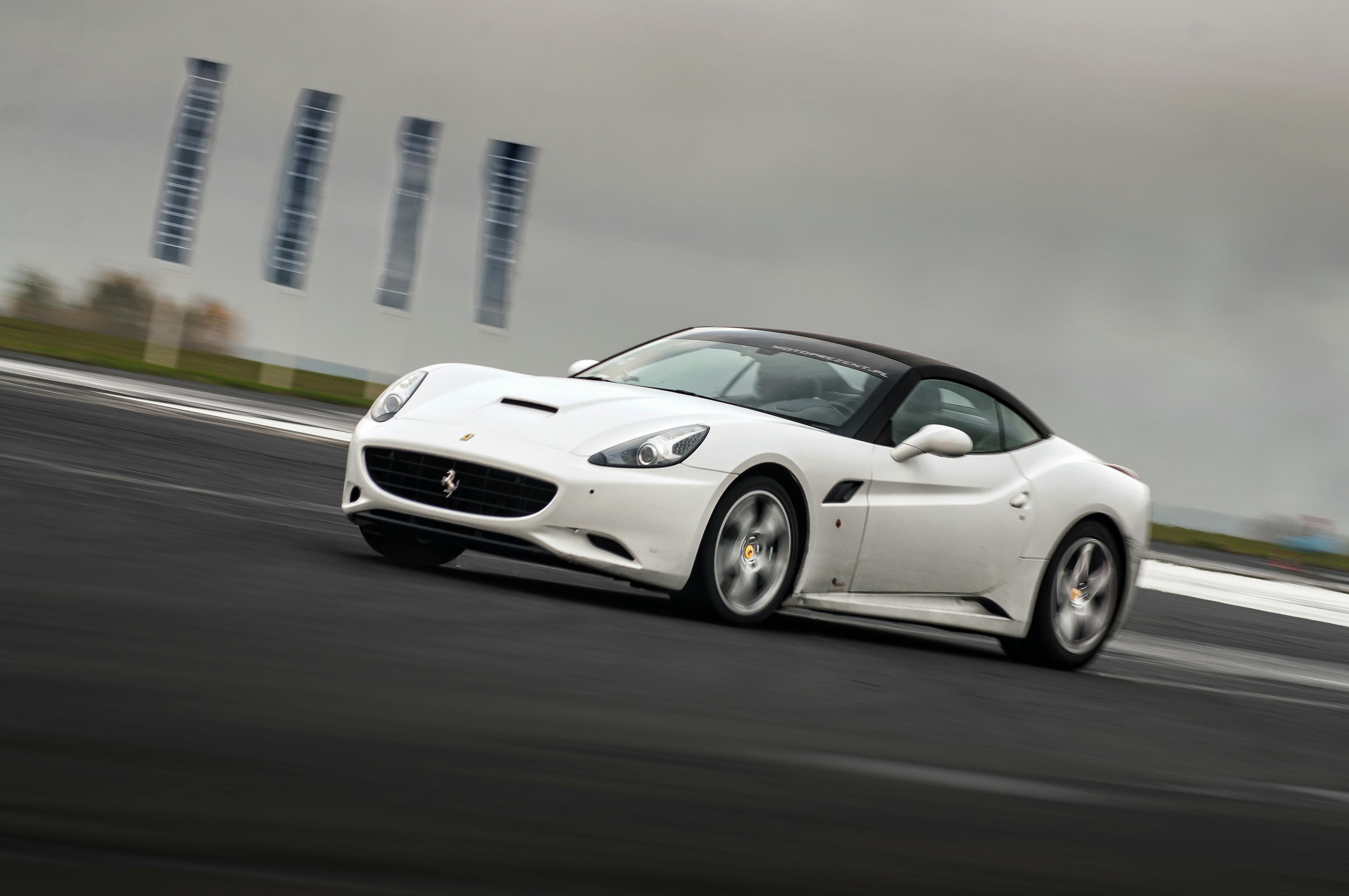 Modern luxury car riding on asphalt road · Free Stock Photo