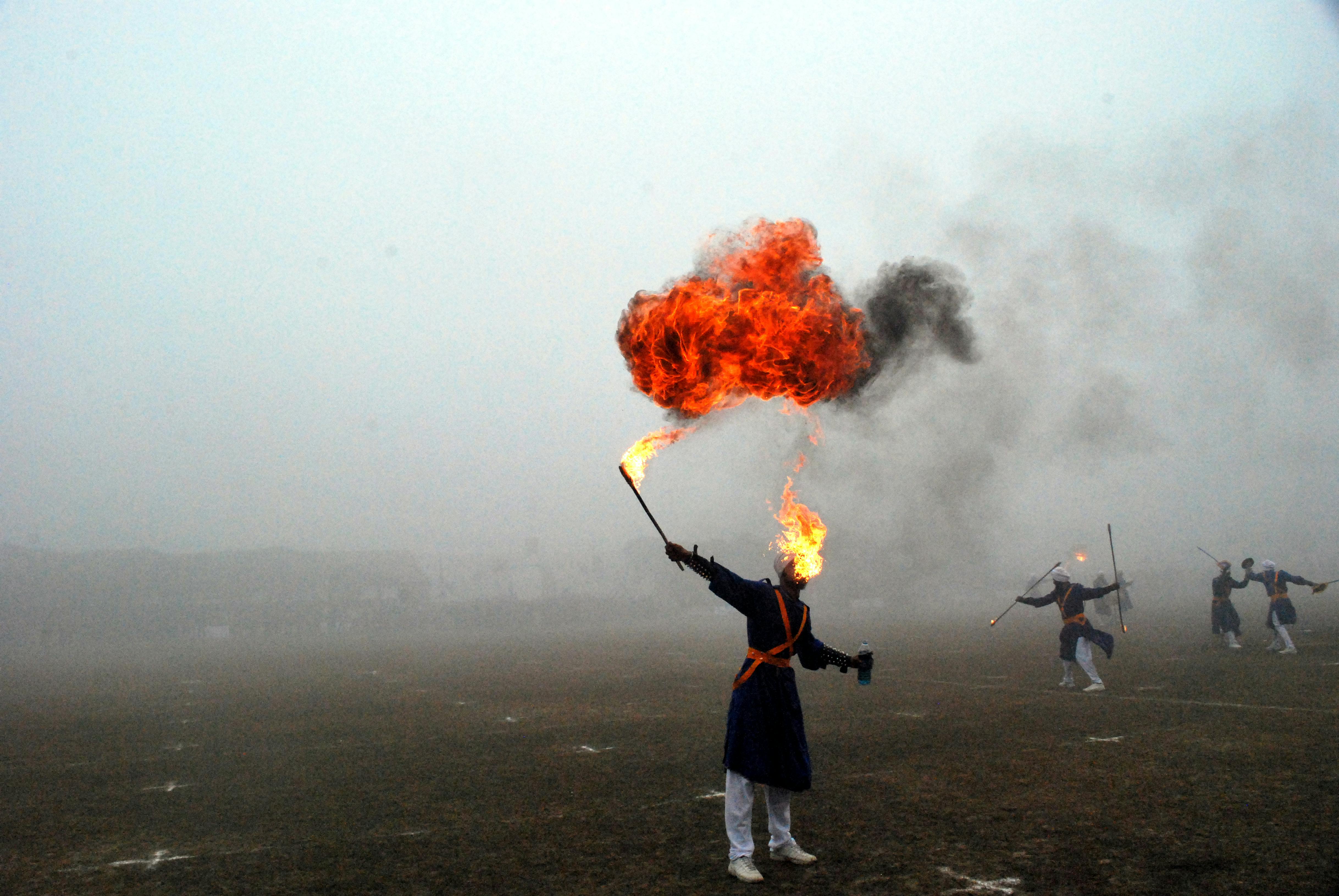 Man in Traditional Clothing Breathing Out Fire · Free Stock Photo