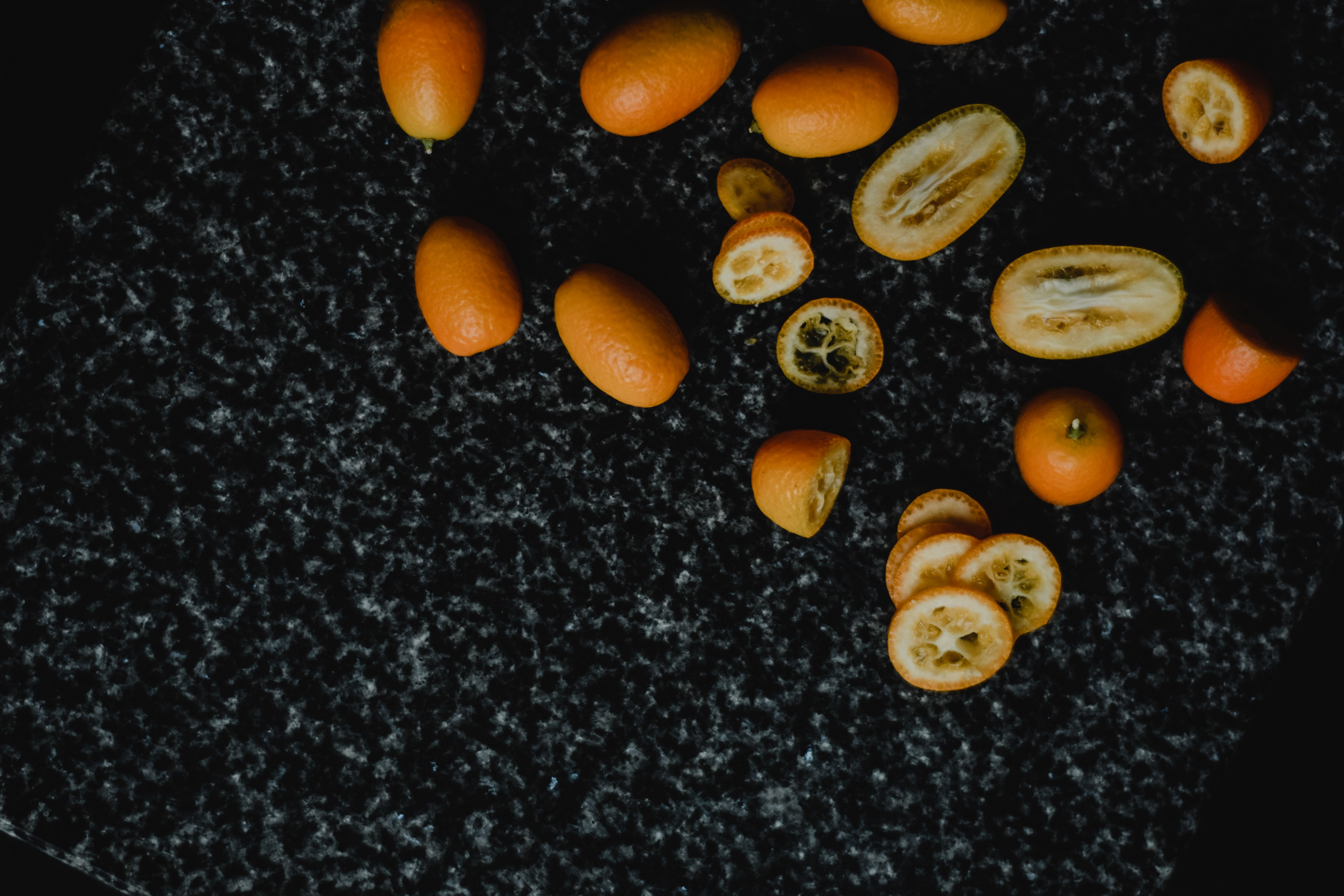 Orange Oval Fruits on Marble Surface · Free Stock Photo