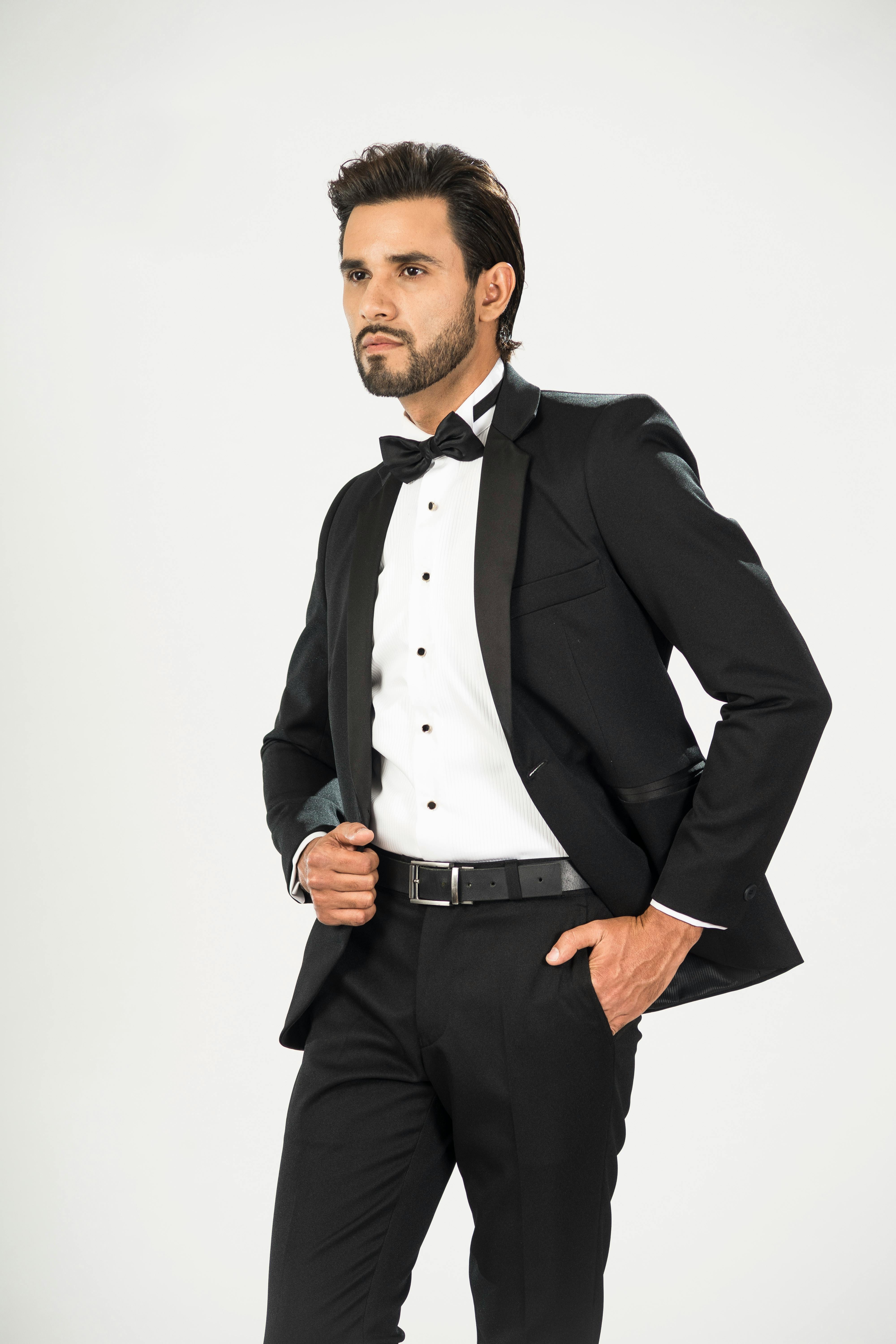 Smiling Young Man in Suit Posing on White Studio Background · Free ...