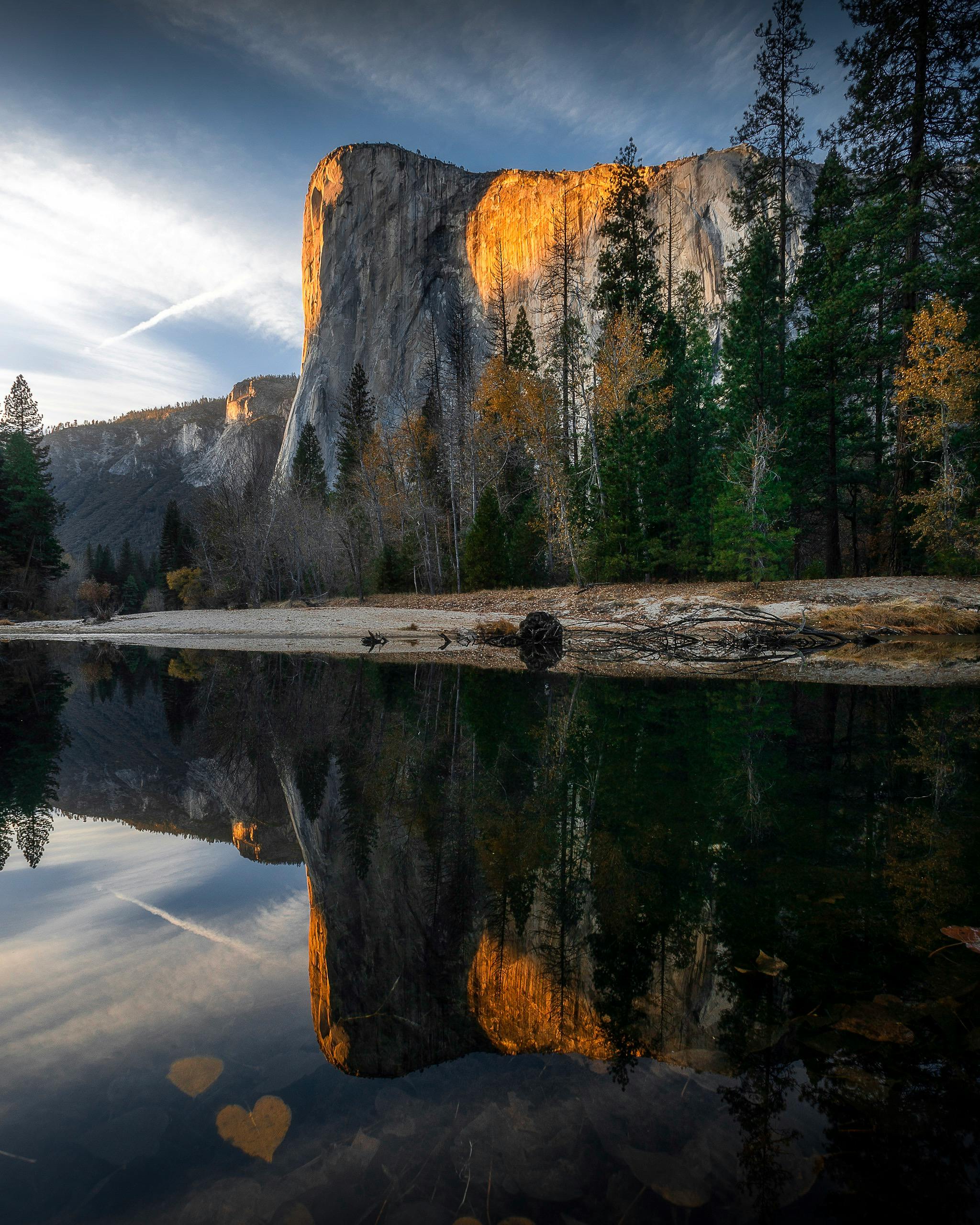 Sharp Rocky Mountain Peak and Rock in Pond · Free Stock Photo