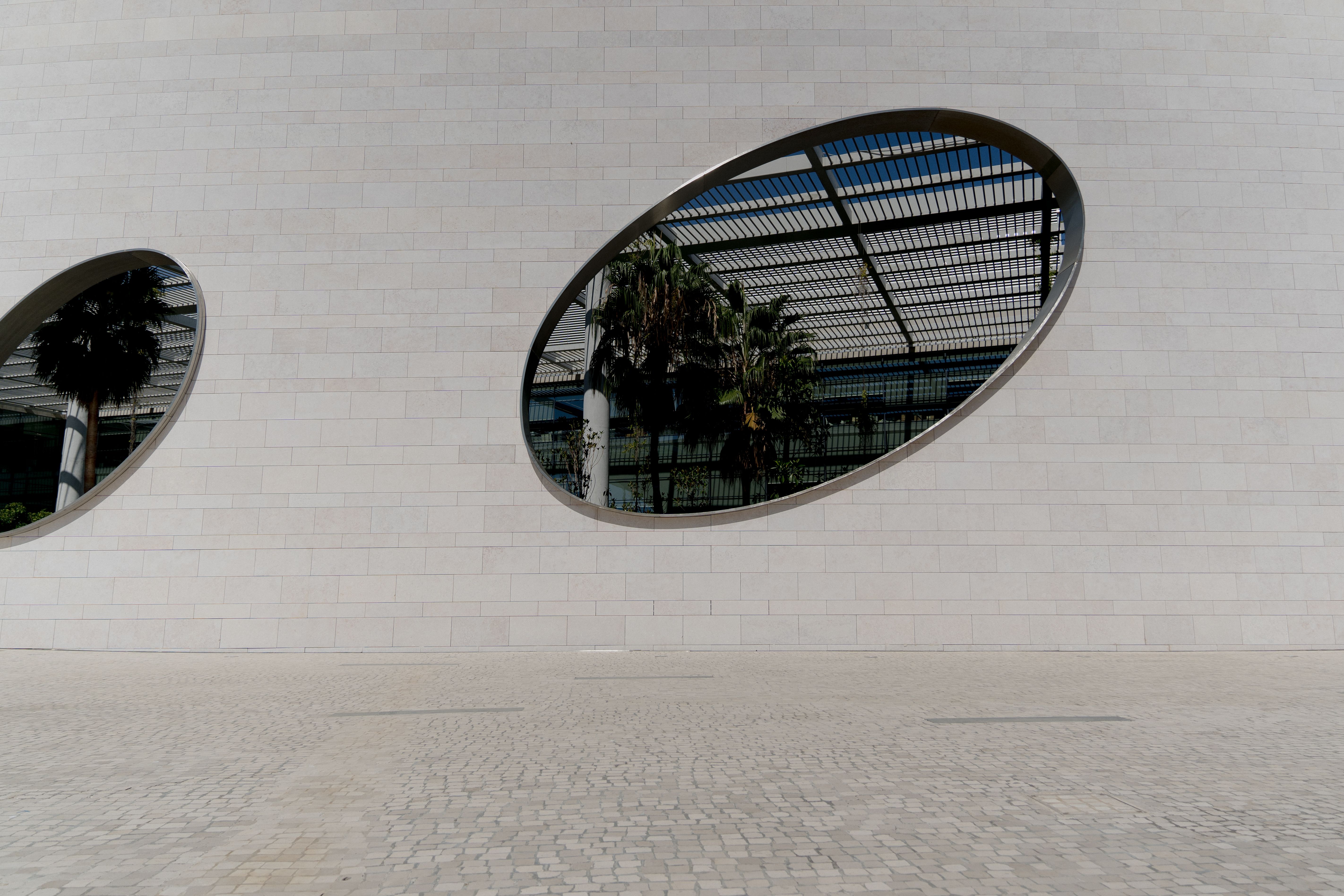 Concrete Wall With Round Windows · Free Stock Photo