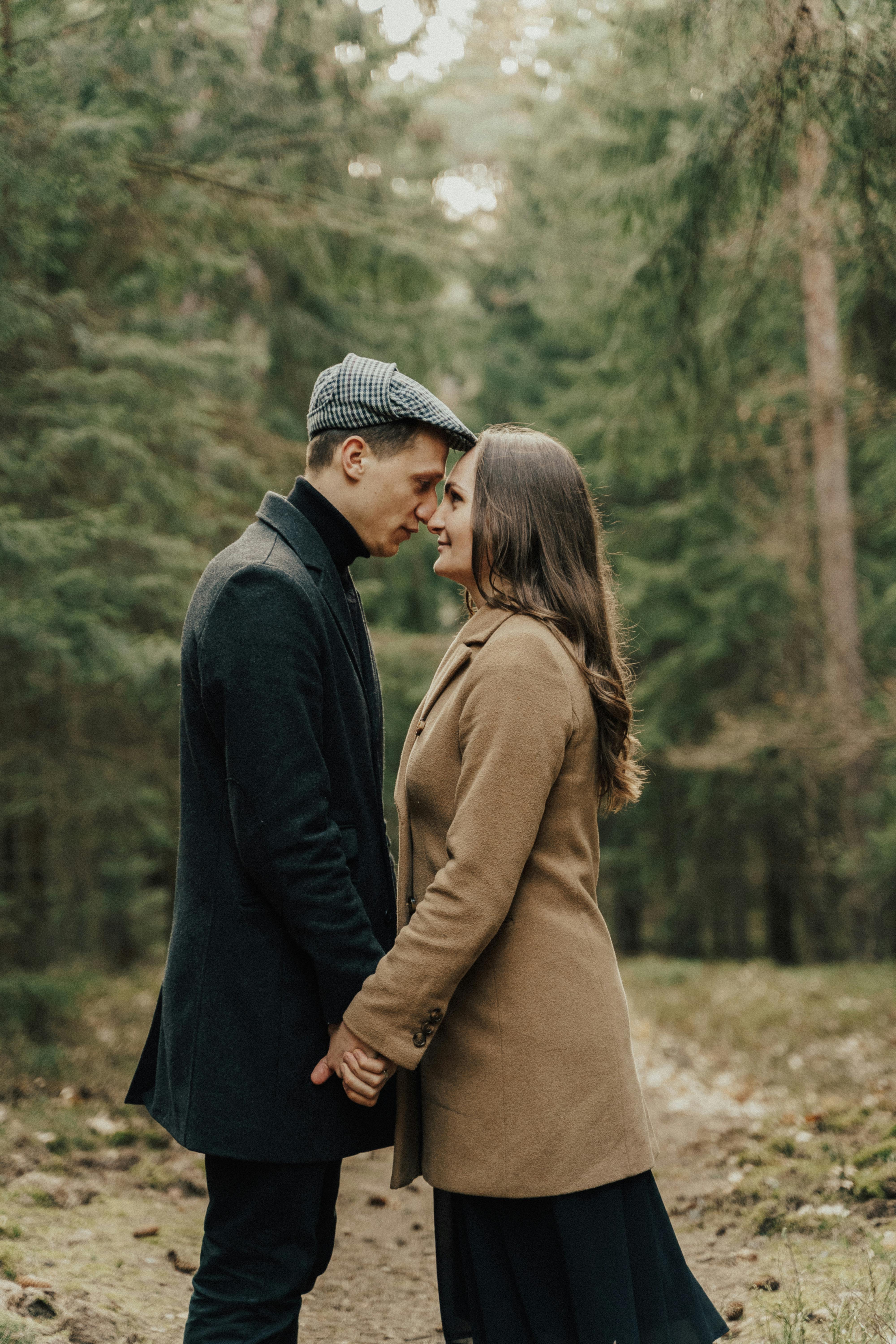 Man and Woman Standing Face to Face In The Woods · Free Stock Photo