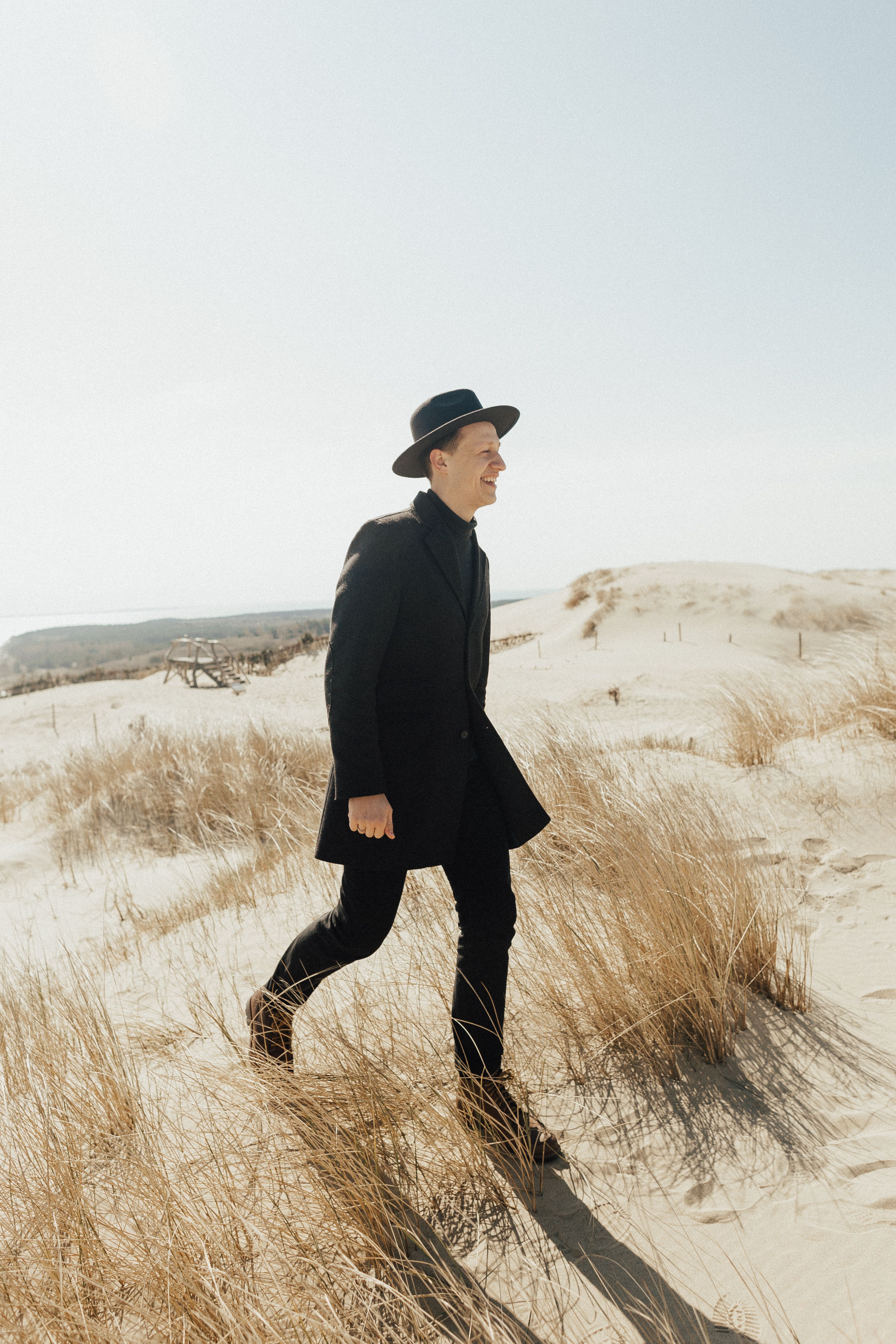 A Man Walking on Sand · Free Stock Photo