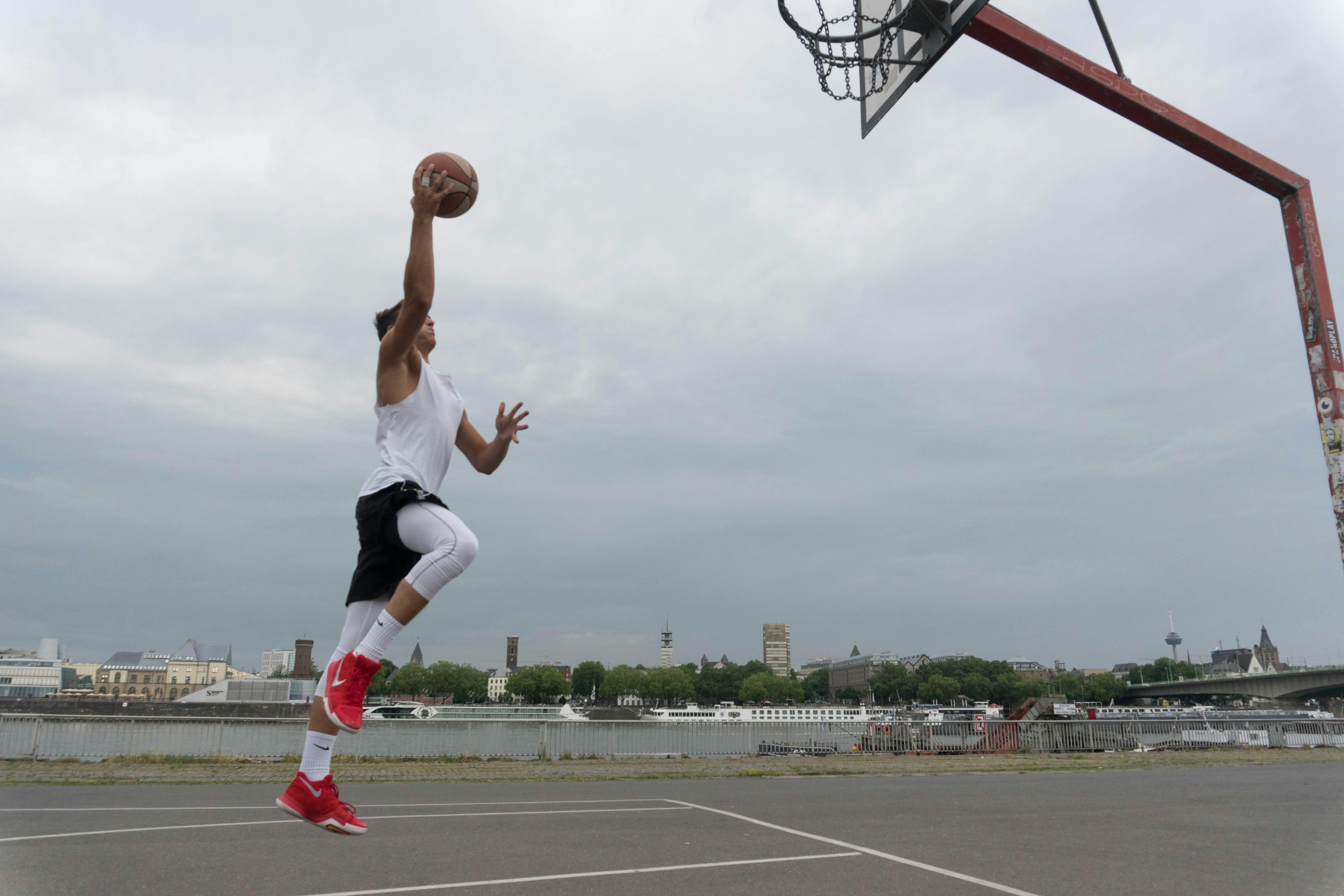 A Man Shooting a Basketball · Free Stock Photo