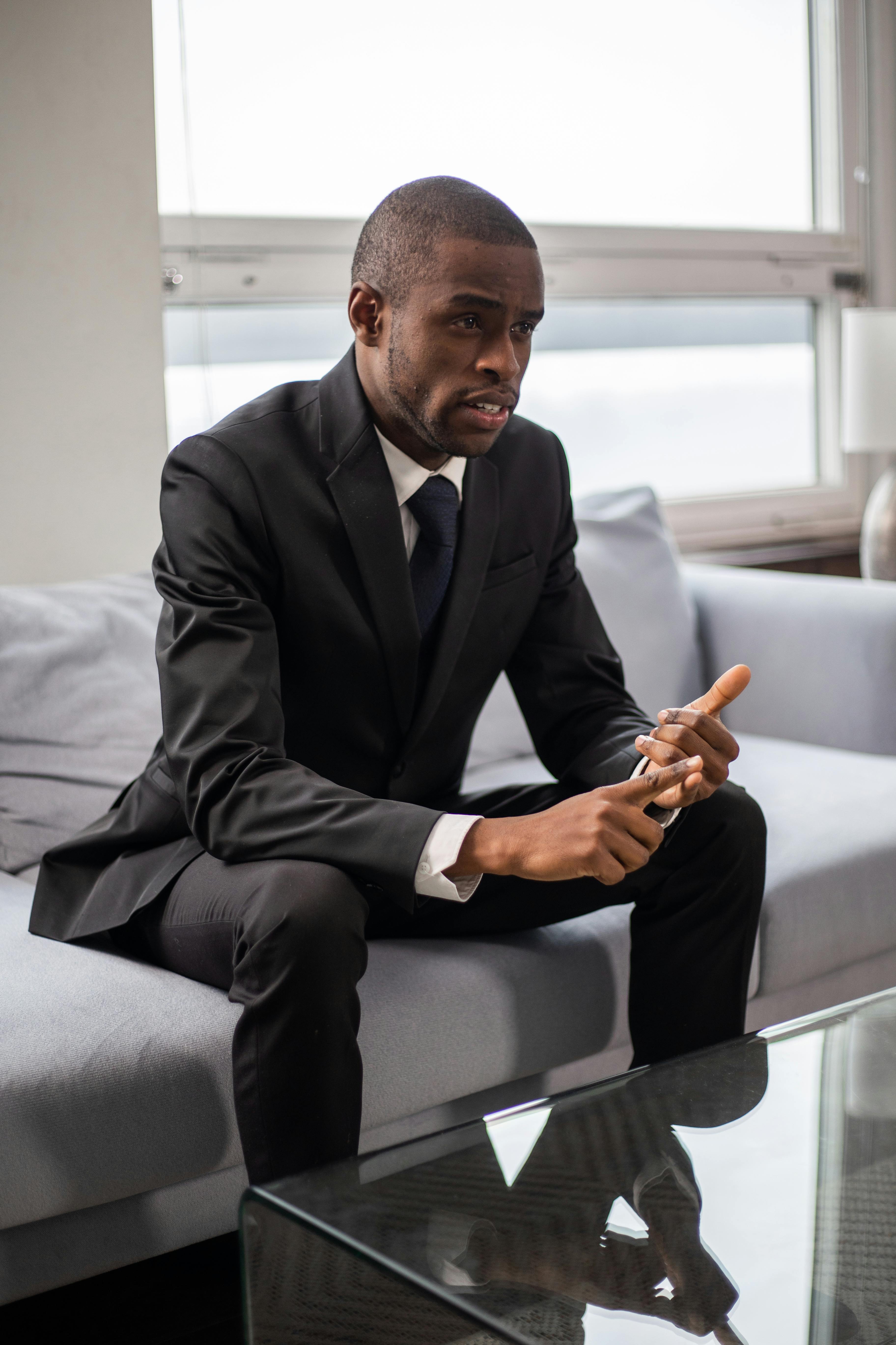 Man in Black Suit Smiling at the Camera · Free Stock Photo