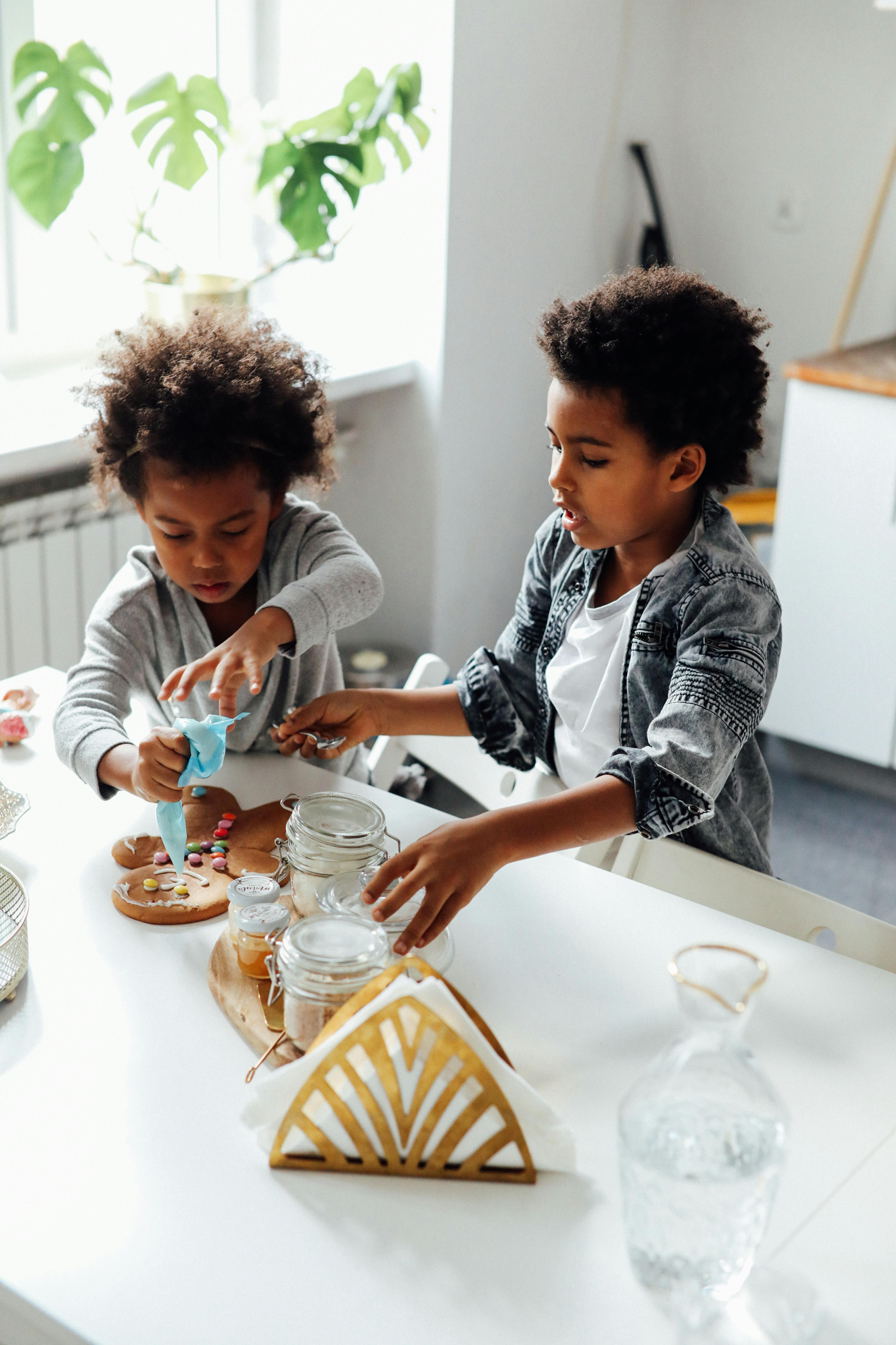 Girl and Boy Holding Icing Decor · Free Stock Photo
