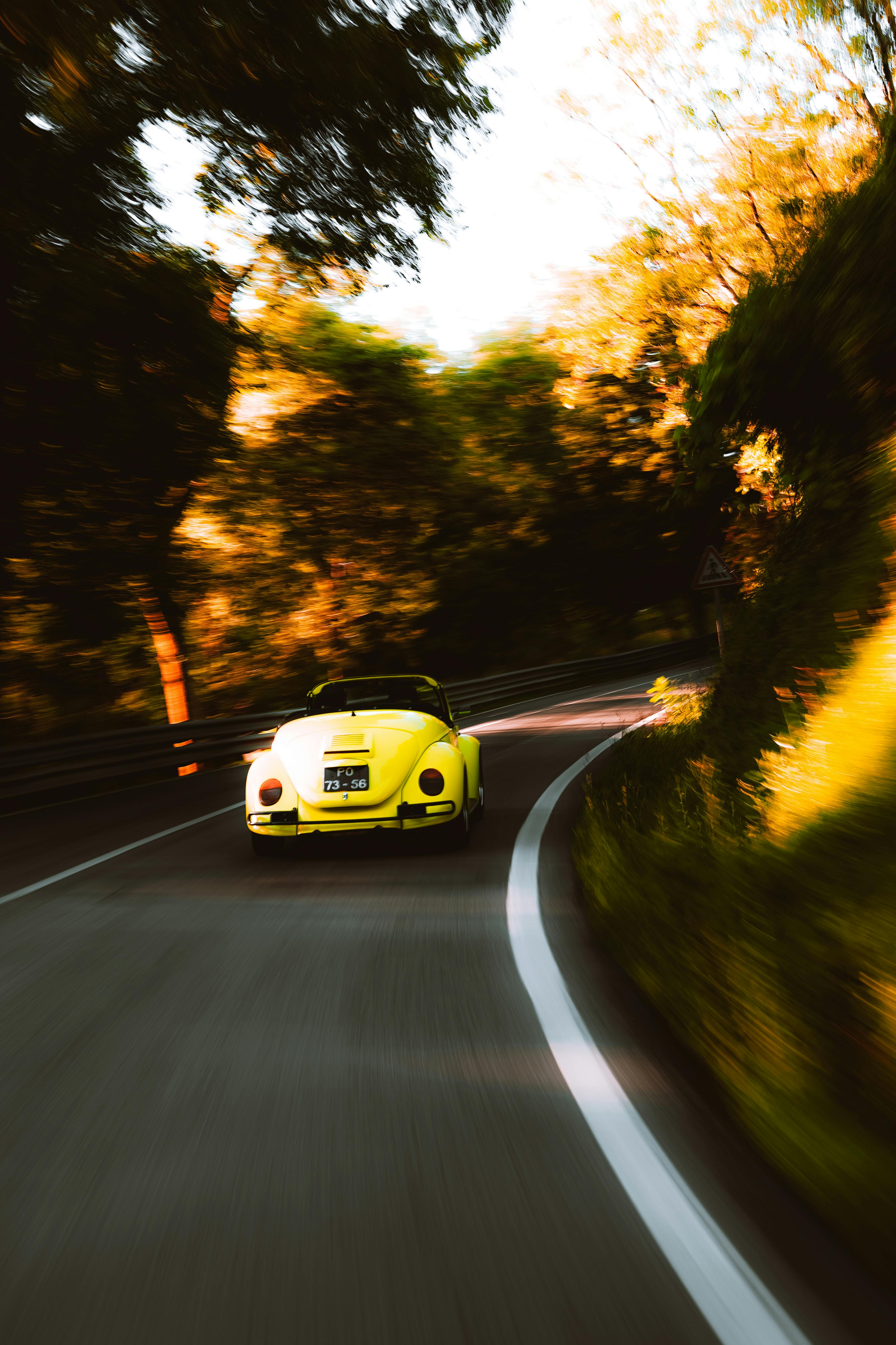A Yellow Car on the Road · Free Stock Photo