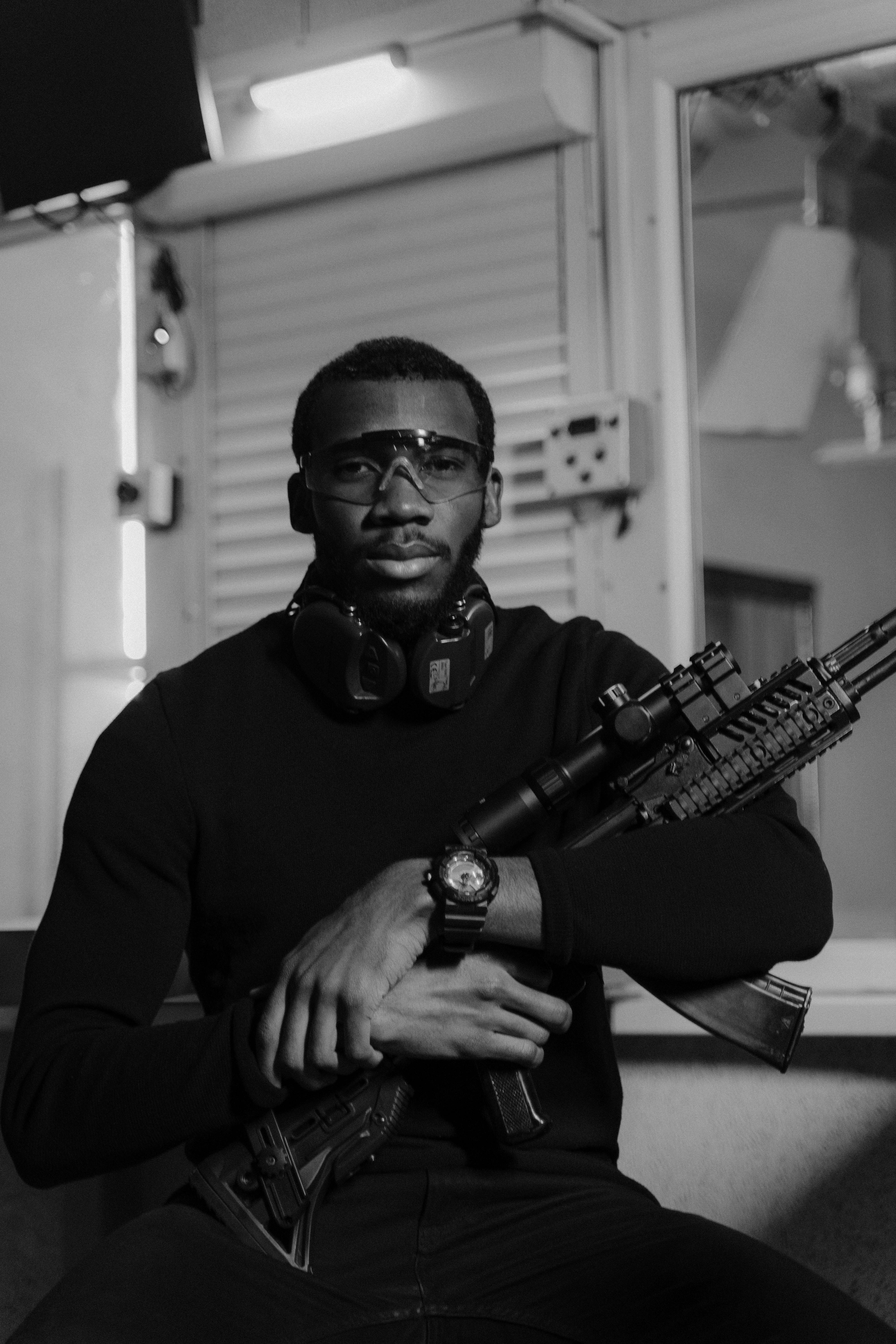 A Man Carrying Sniper Rifle · Free Stock Photo