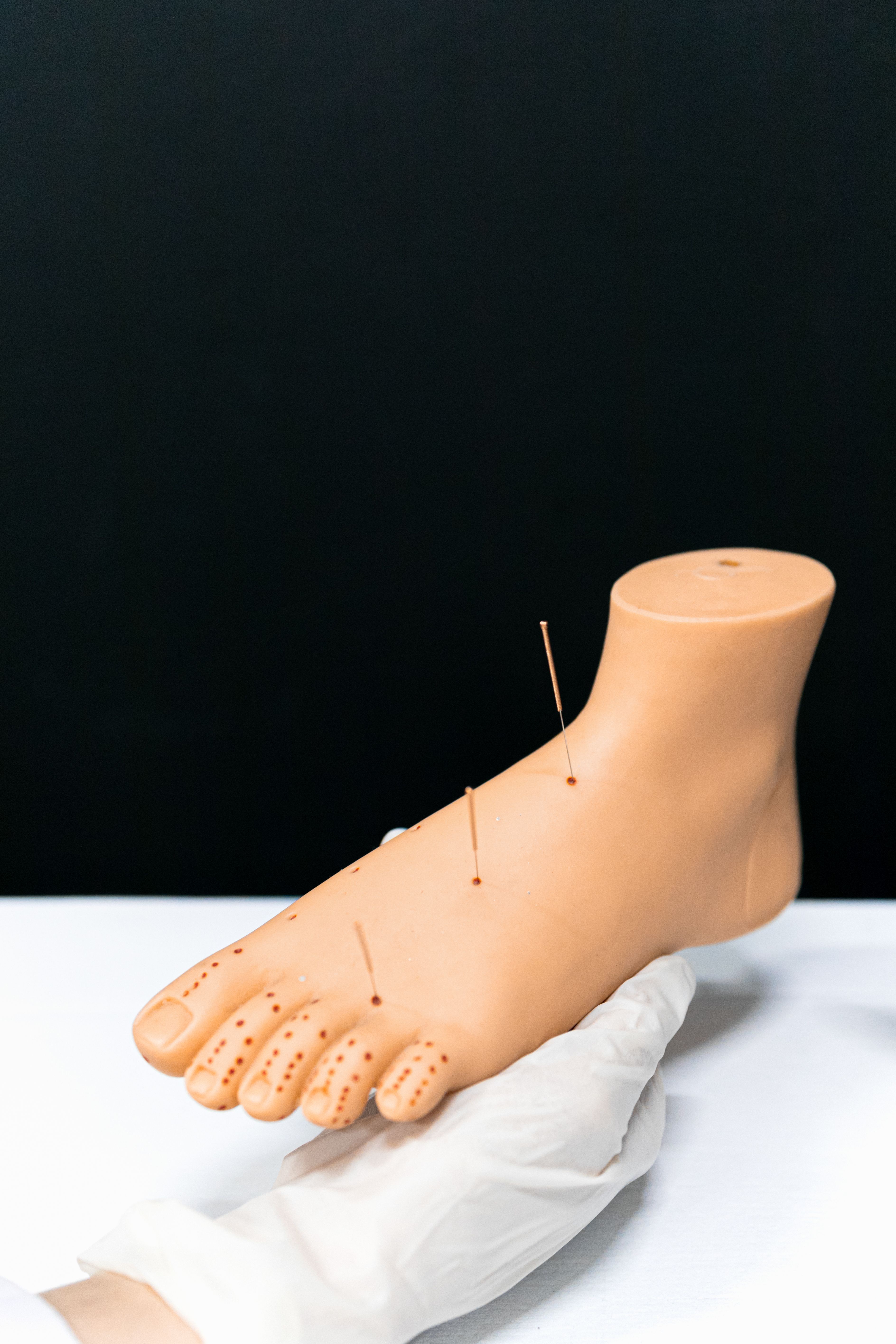 Person Putting Needles to the Knees · Free Stock Photo