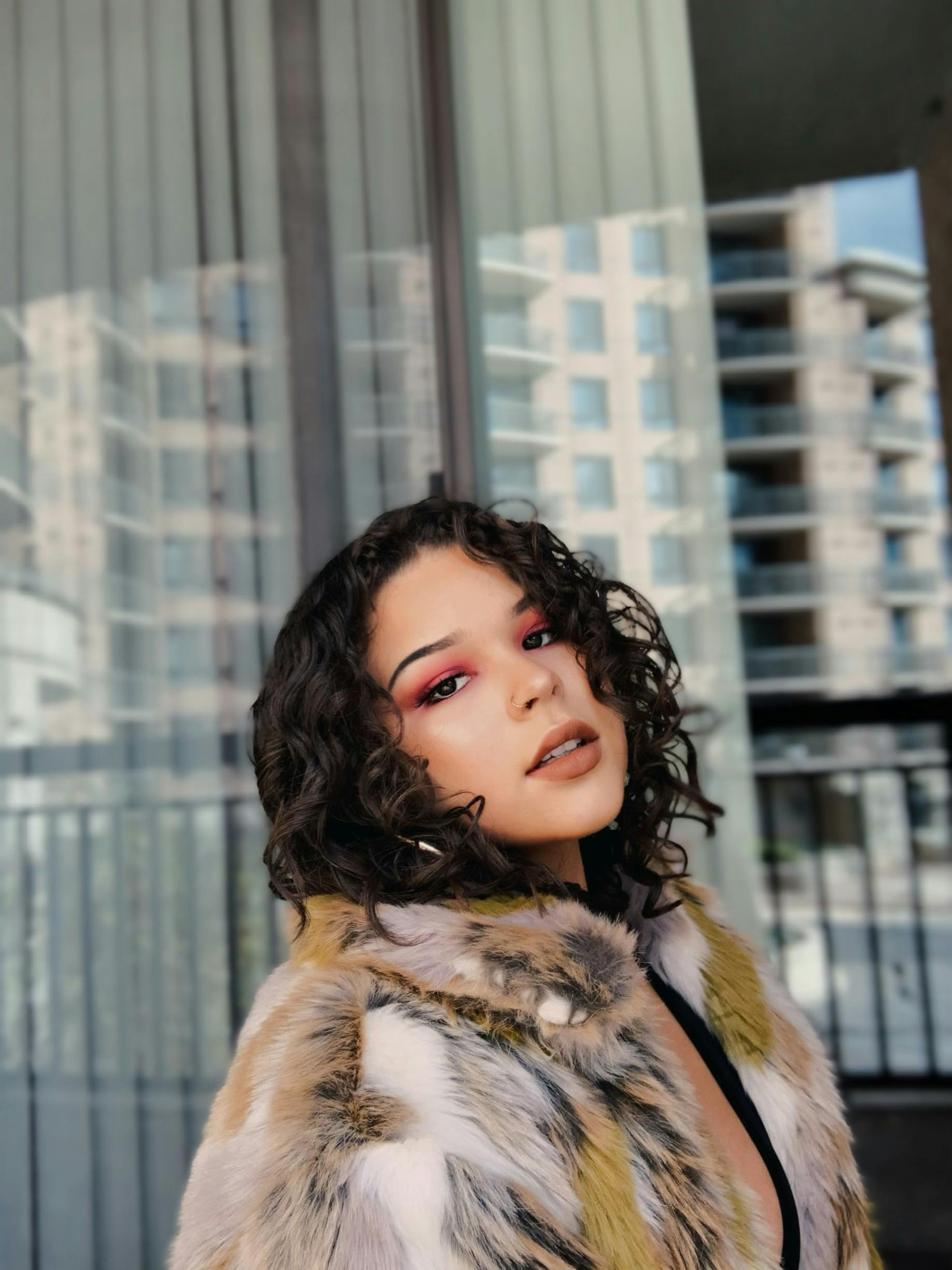 Woman and City Buildings Reflected in Window · Free Stock Photo