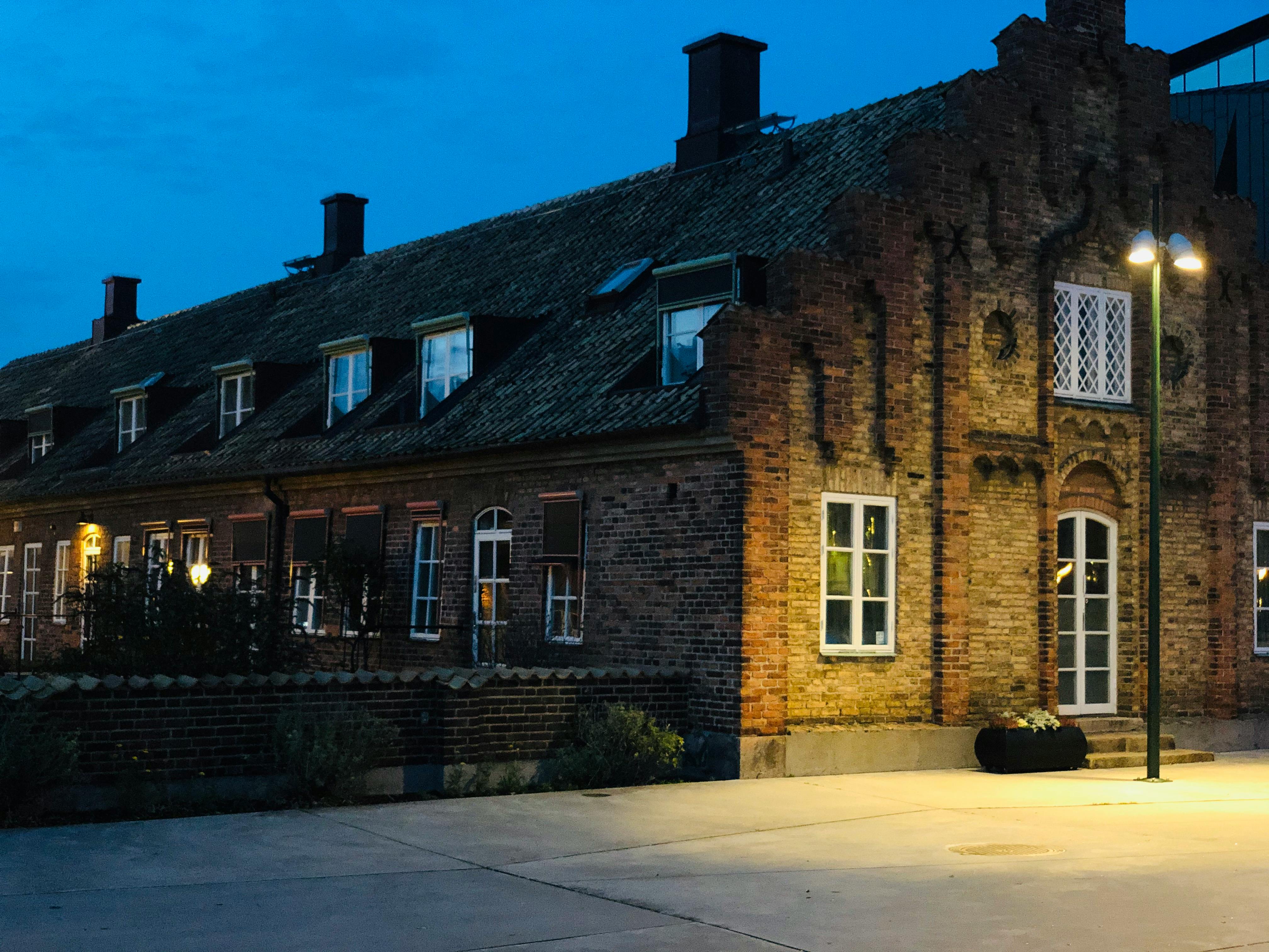 A Brick Building at Night · Free Stock Photo