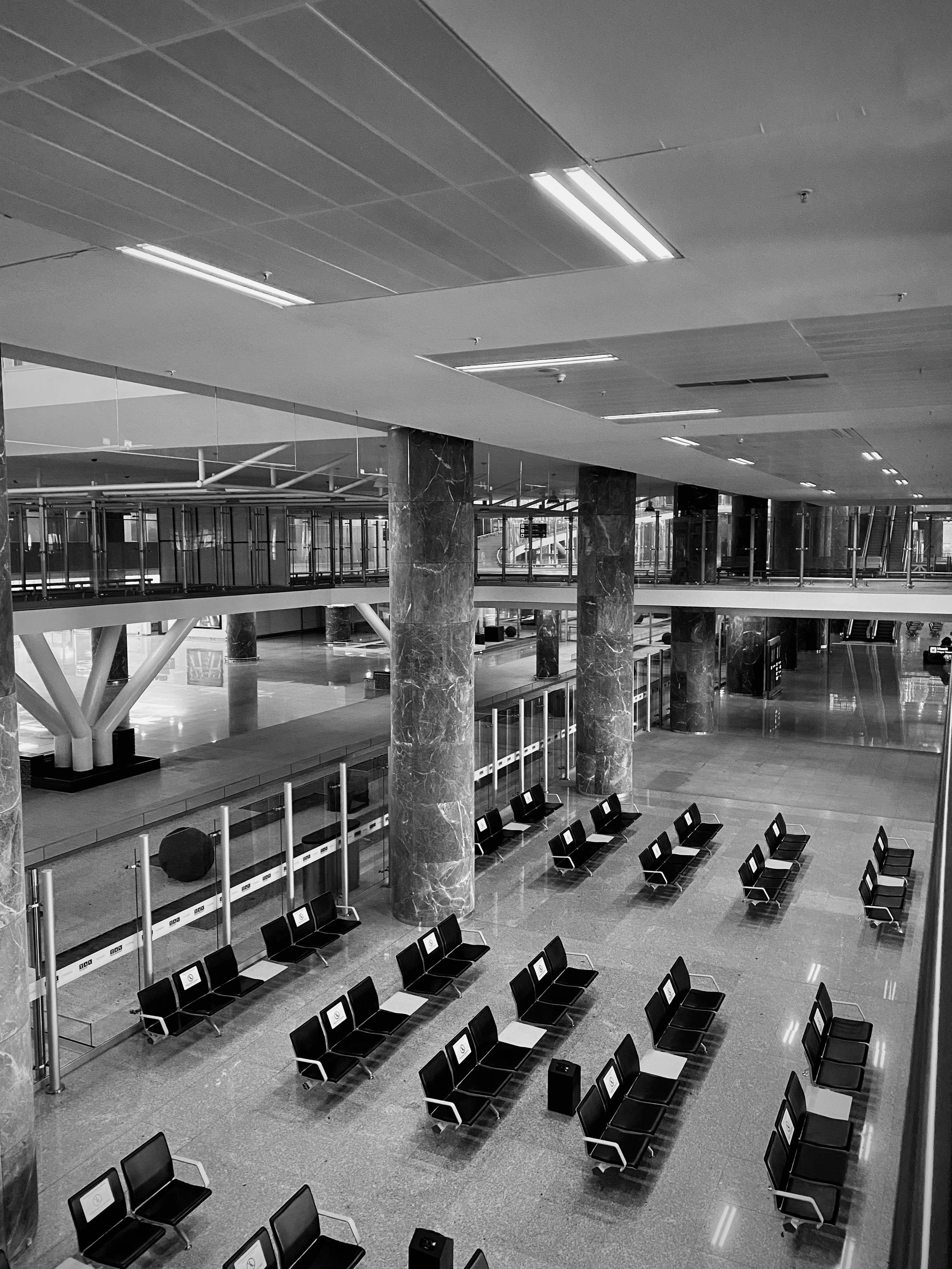 Grayscale Photo of An Empty Airport Terminal · Free Stock Photo