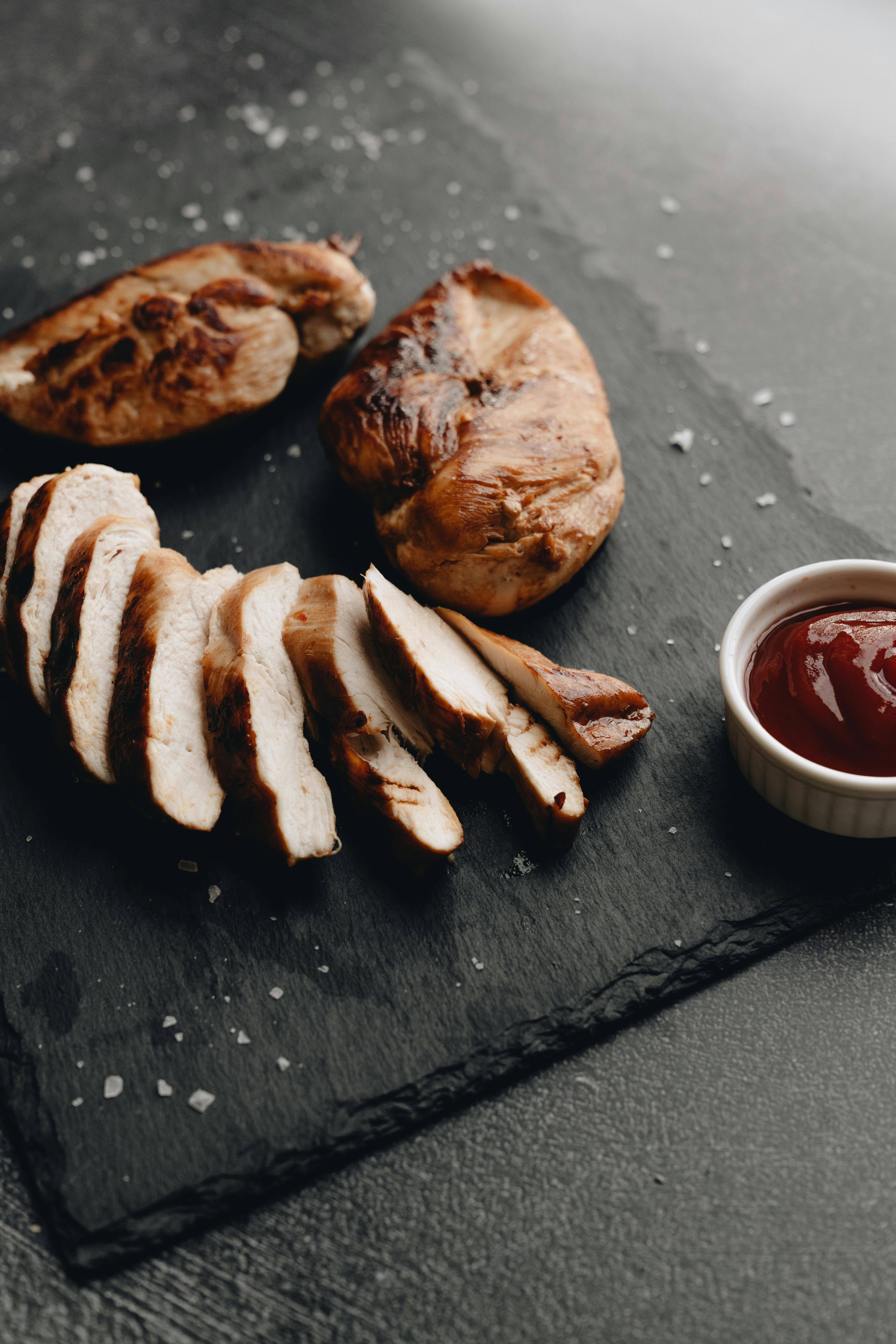 Sliced Meat on Black Slate · Free Stock Photo