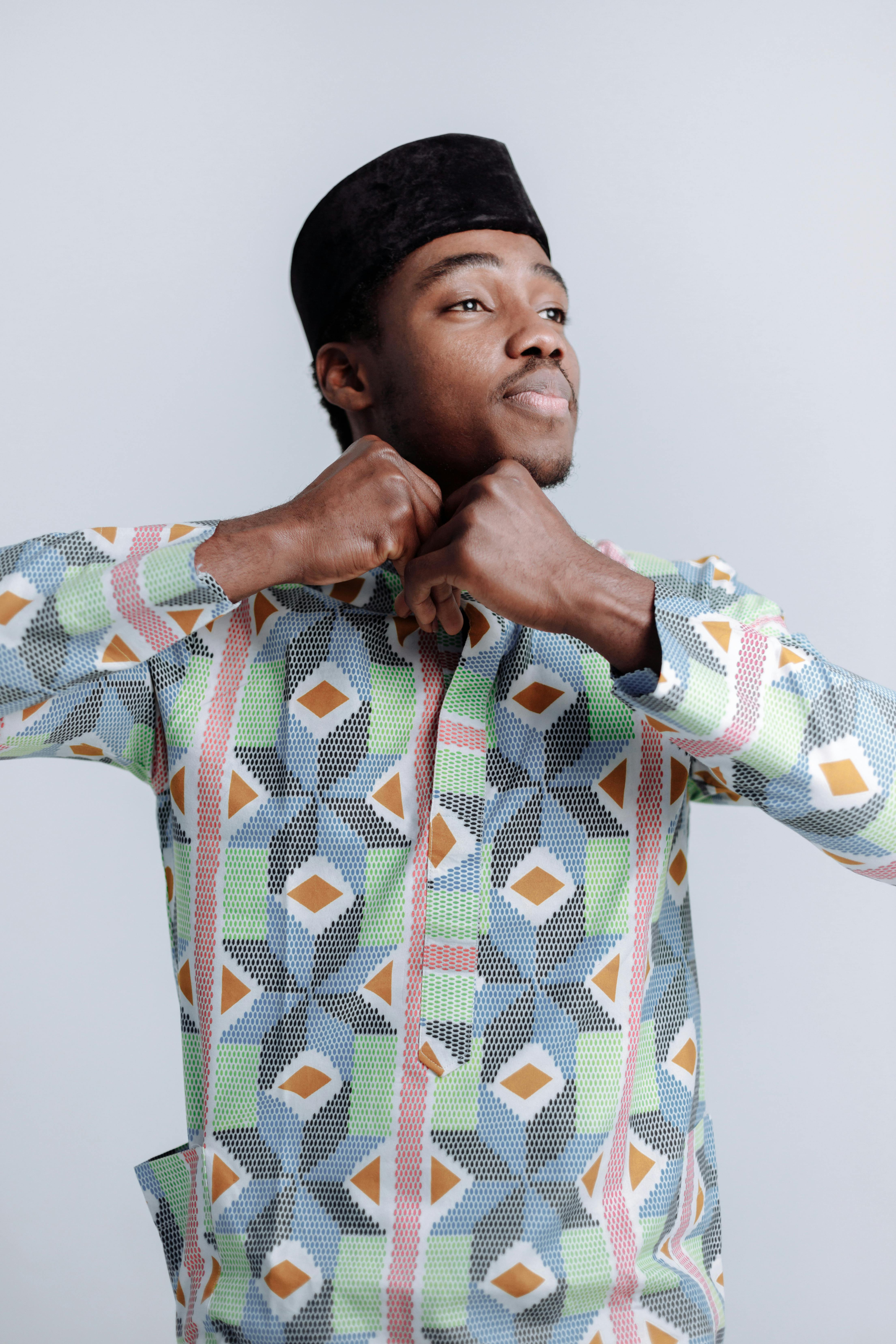 Man in Black Suit Standing Firm while Looking Afar · Free Stock Photo