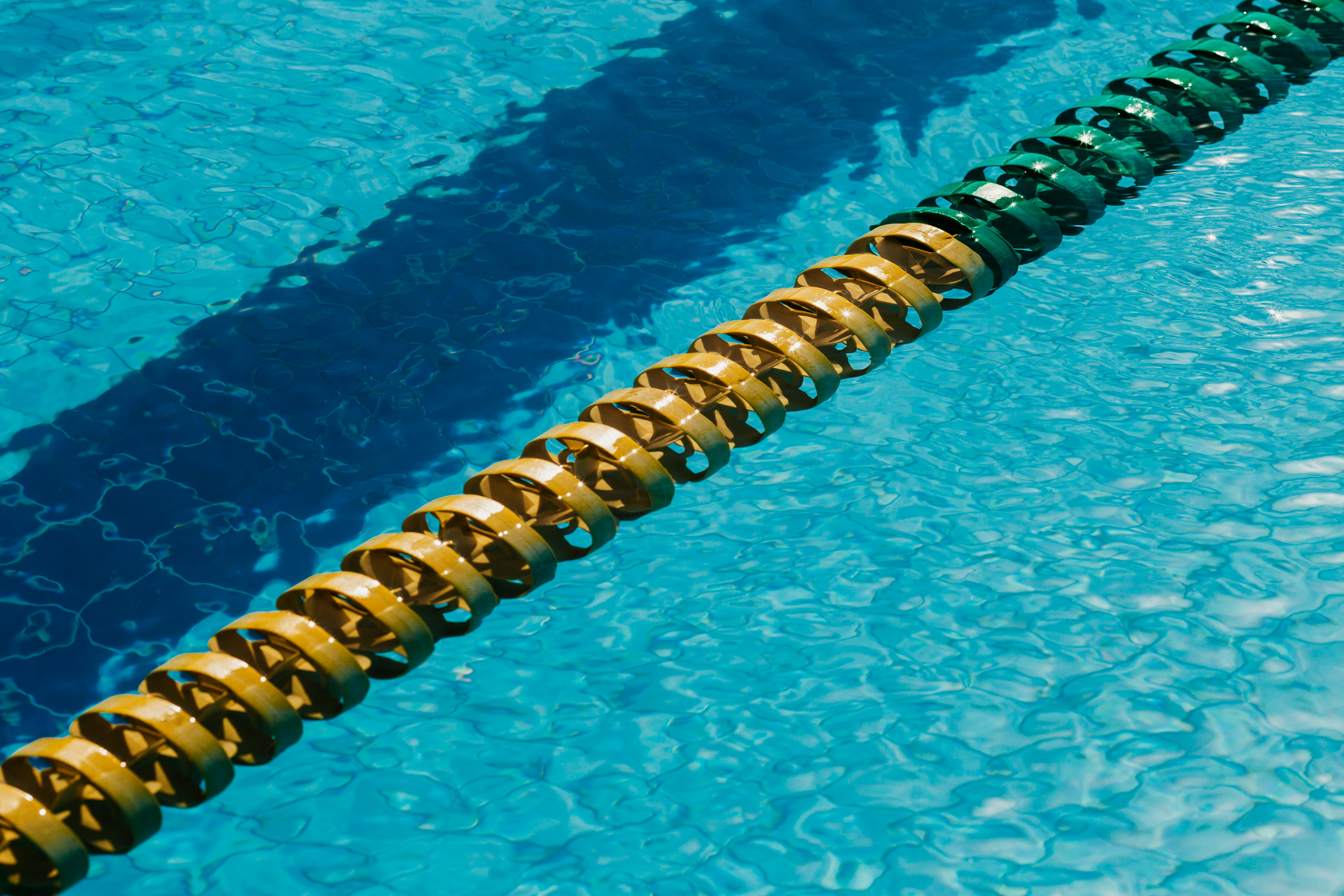 Swimming pool with lane markers in blue water · Free Stock Photo