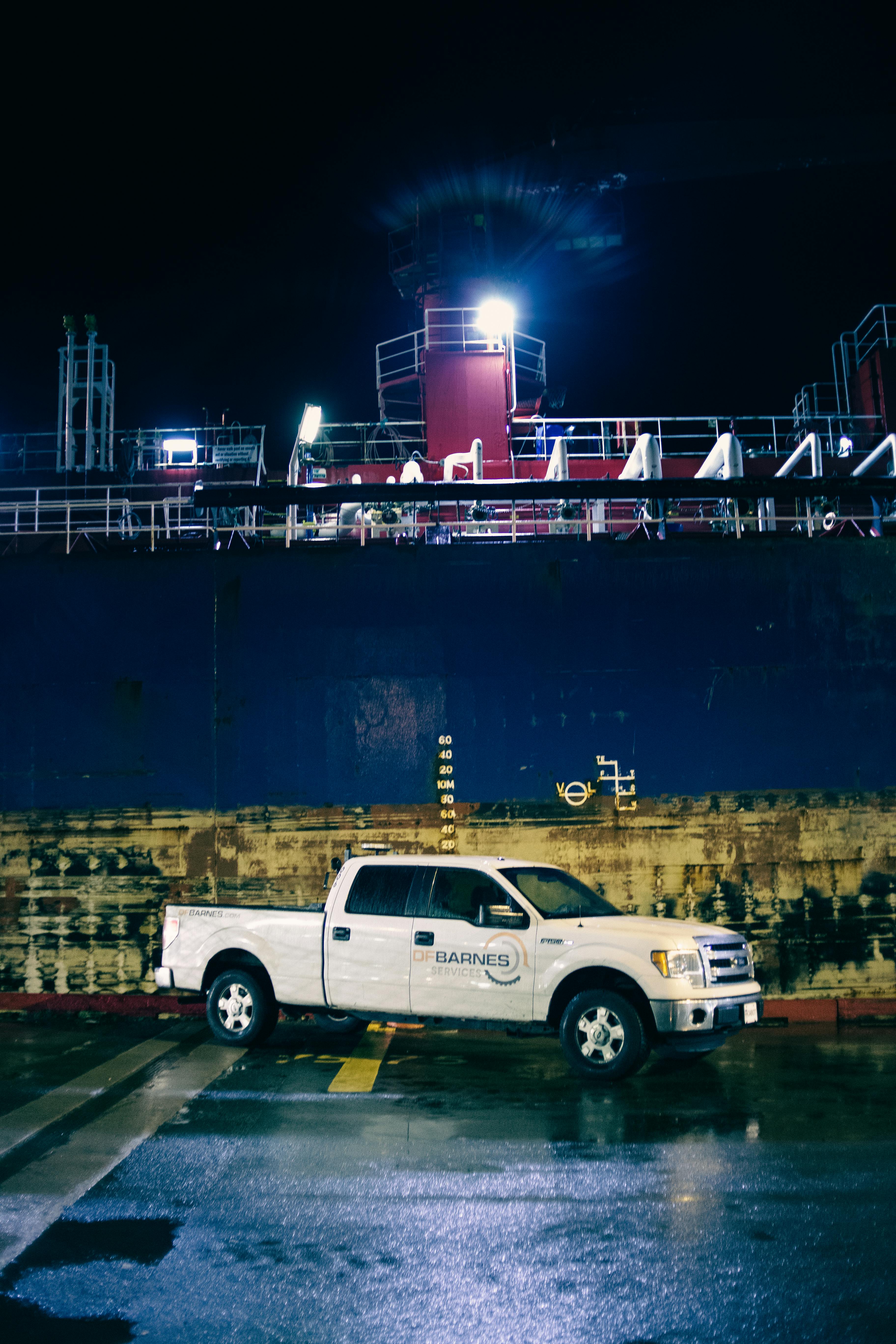 White pickup car on parking lot at night · Free Stock Photo