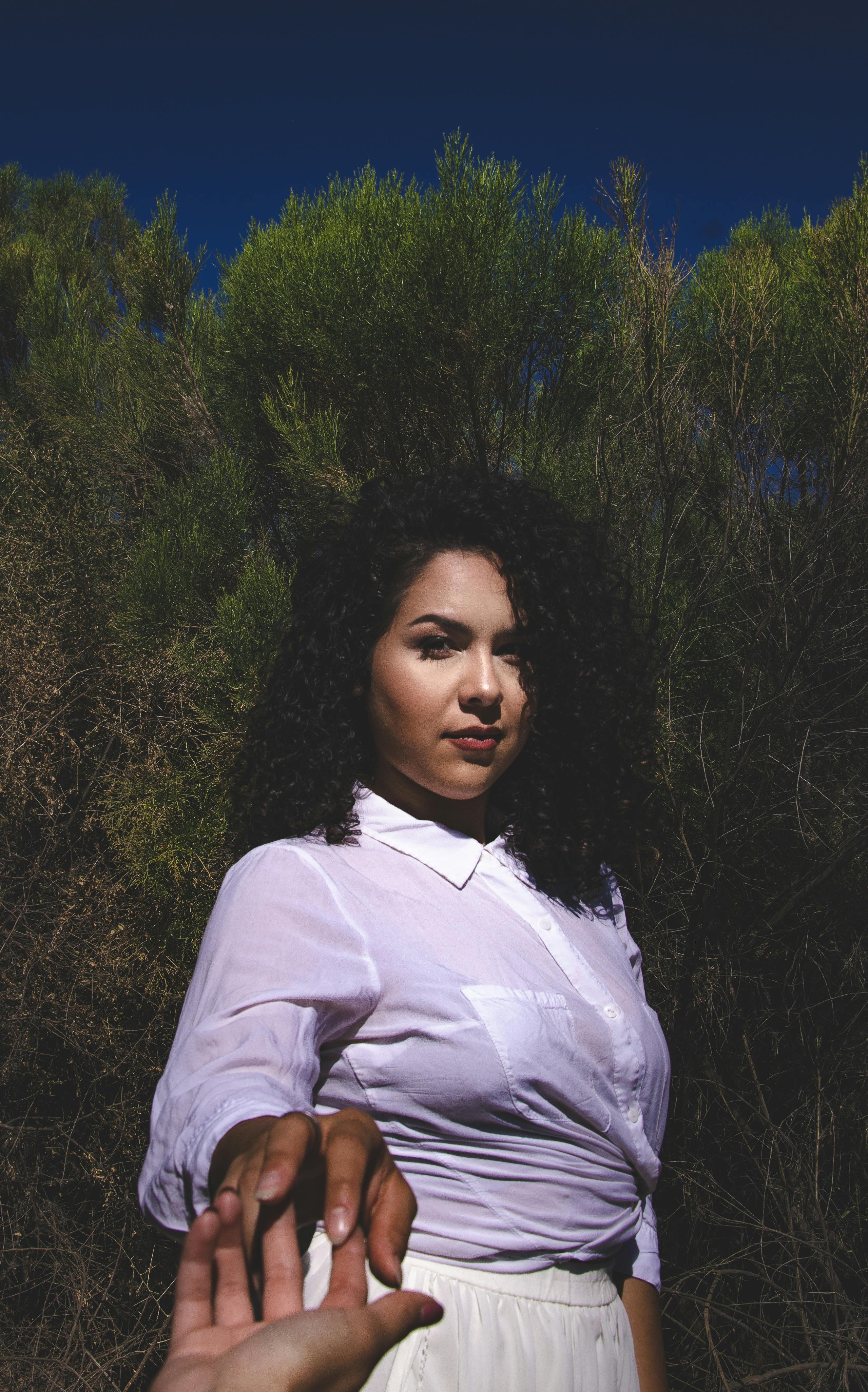 Trendy woman with closed eyes near white cloth · Free Stock Photo