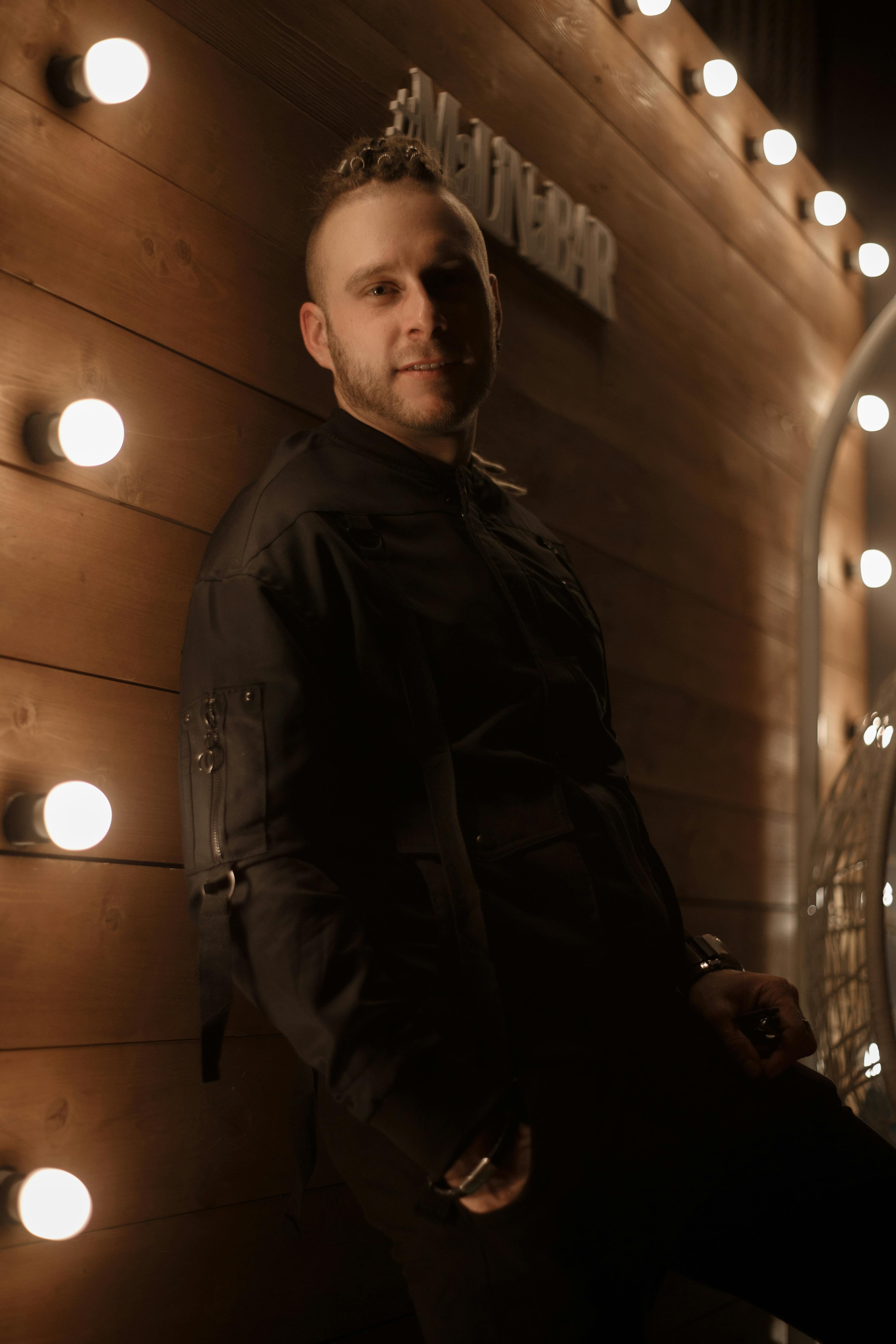 Man with vitiligo touching hat · Free Stock Photo