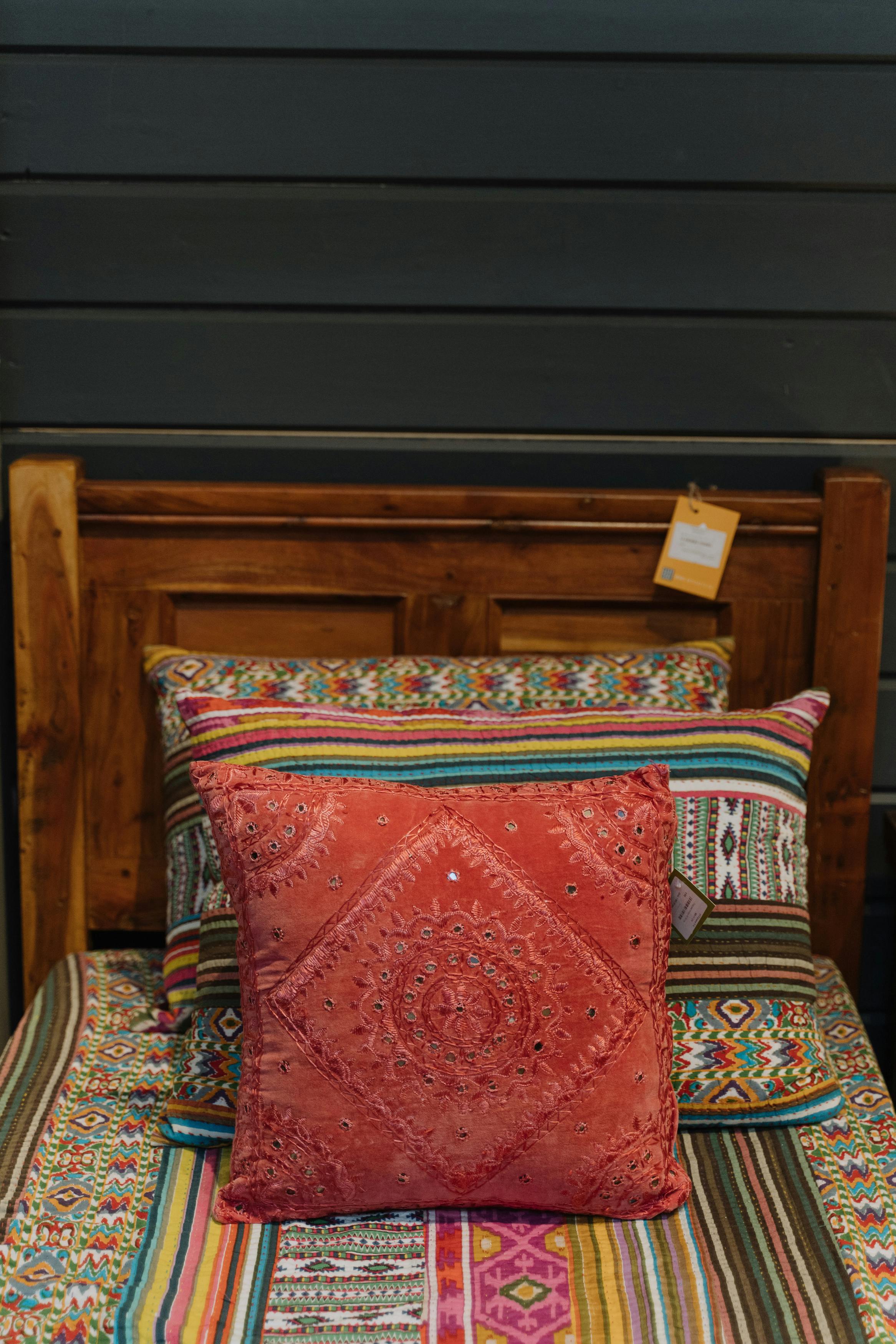 A Single Bed with Throw Pillows · Free Stock Photo