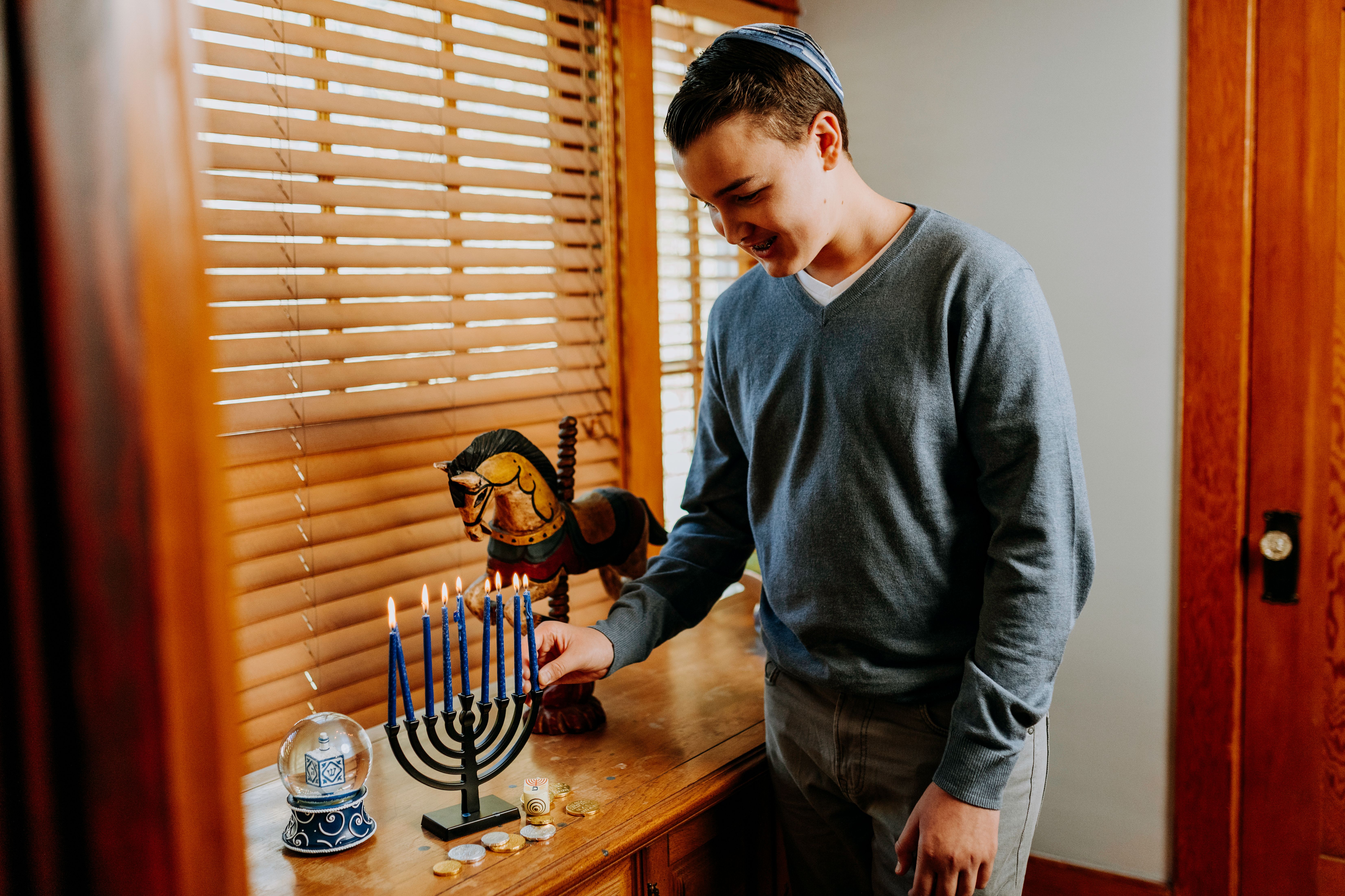 Photo Of Boy Holds A Candlestick · Free Stock Photo