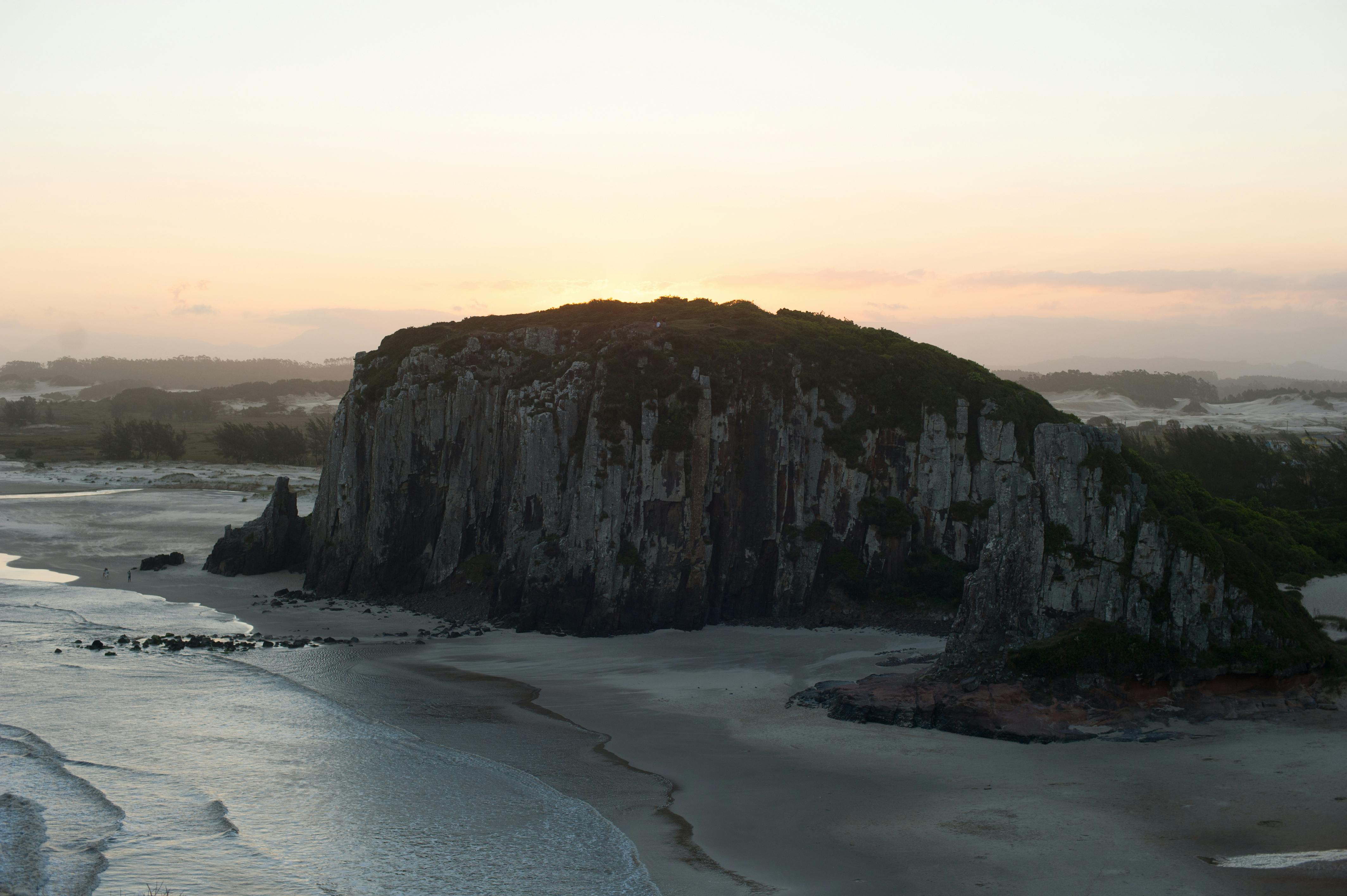 Gray Rock Formation on Sea Shore · Free Stock Photo