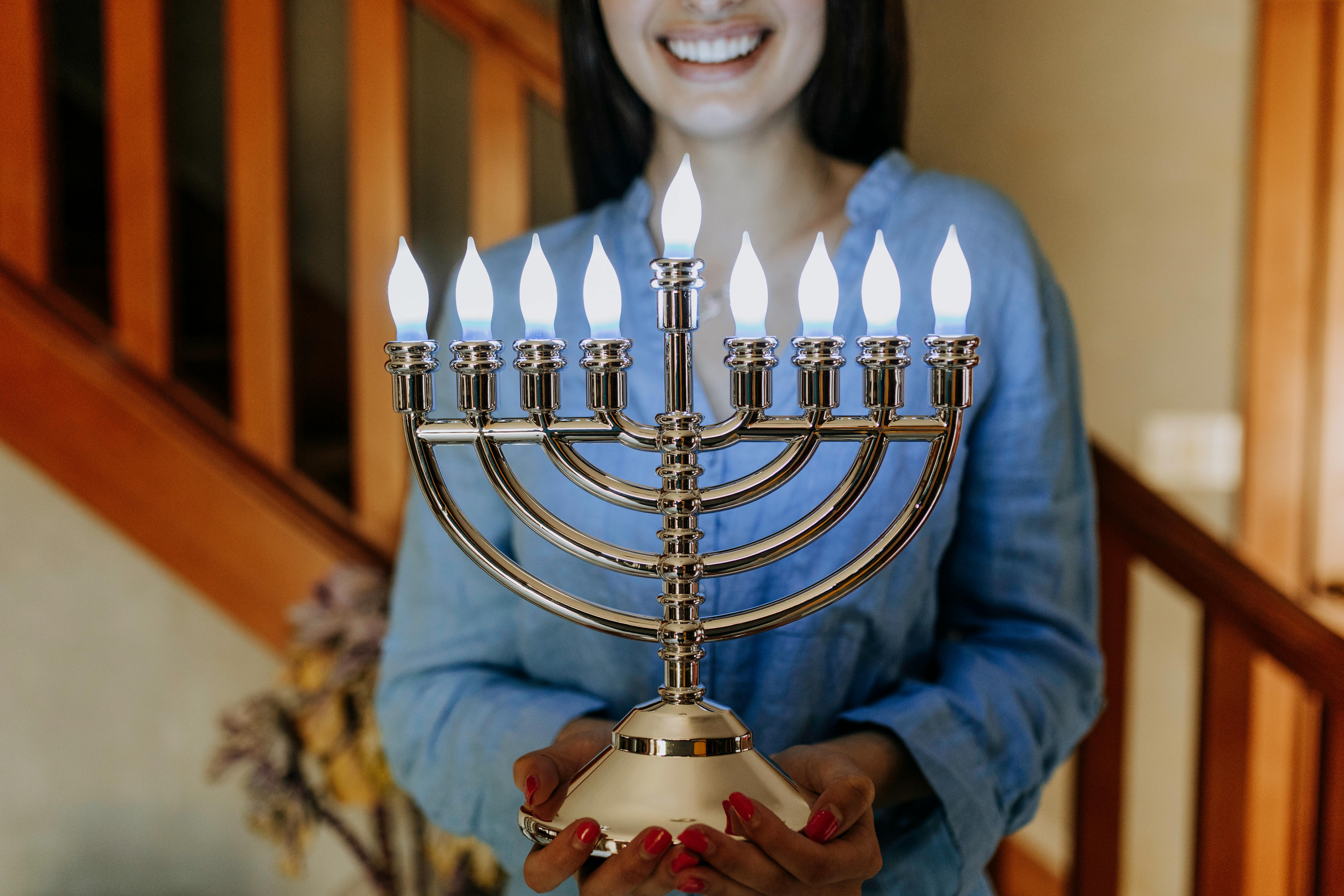 Photo Of Woman Carrying Candle Holder · Free Stock Photo