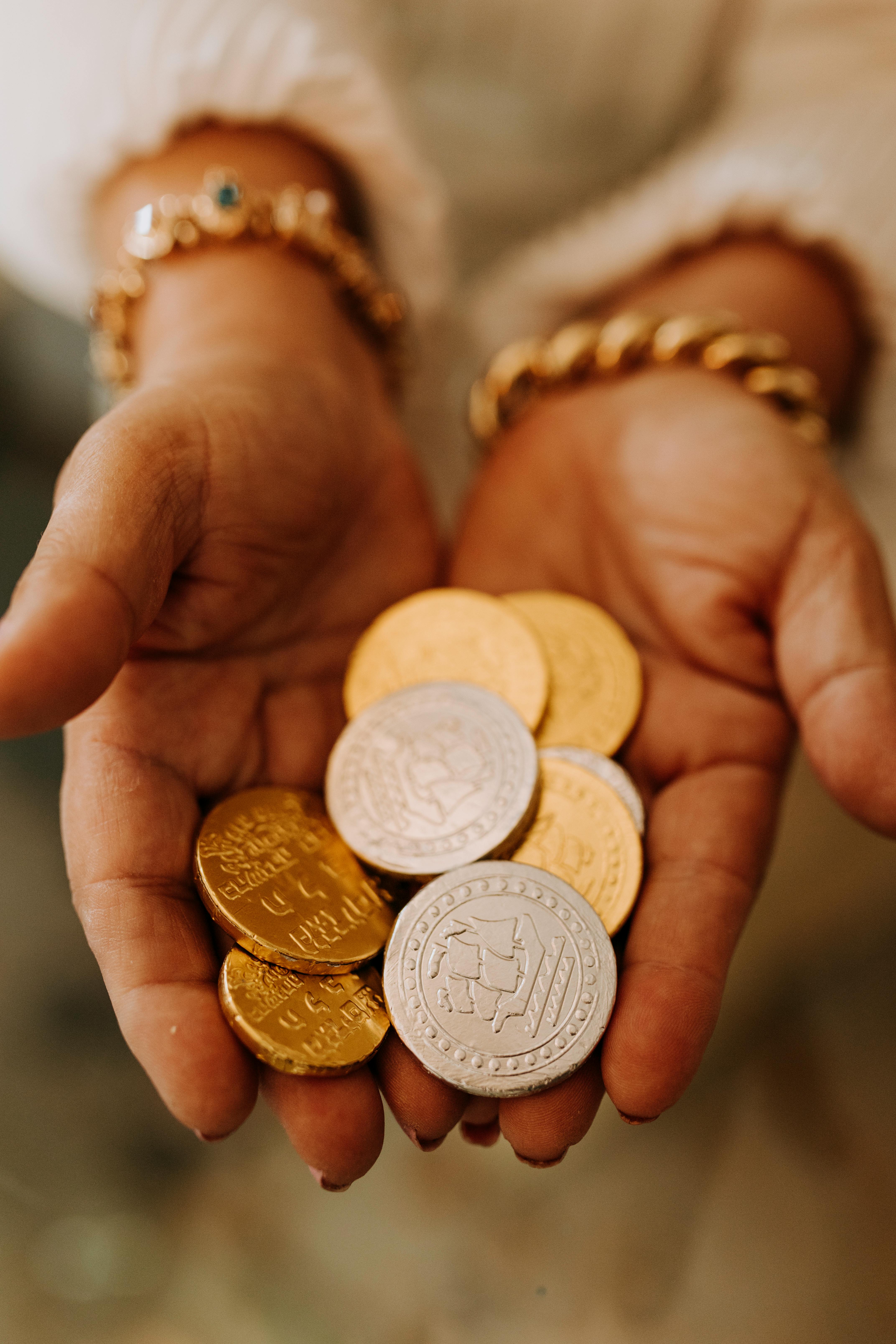 Photo Of Person Holding Gold Round Coins · Free Stock Photo