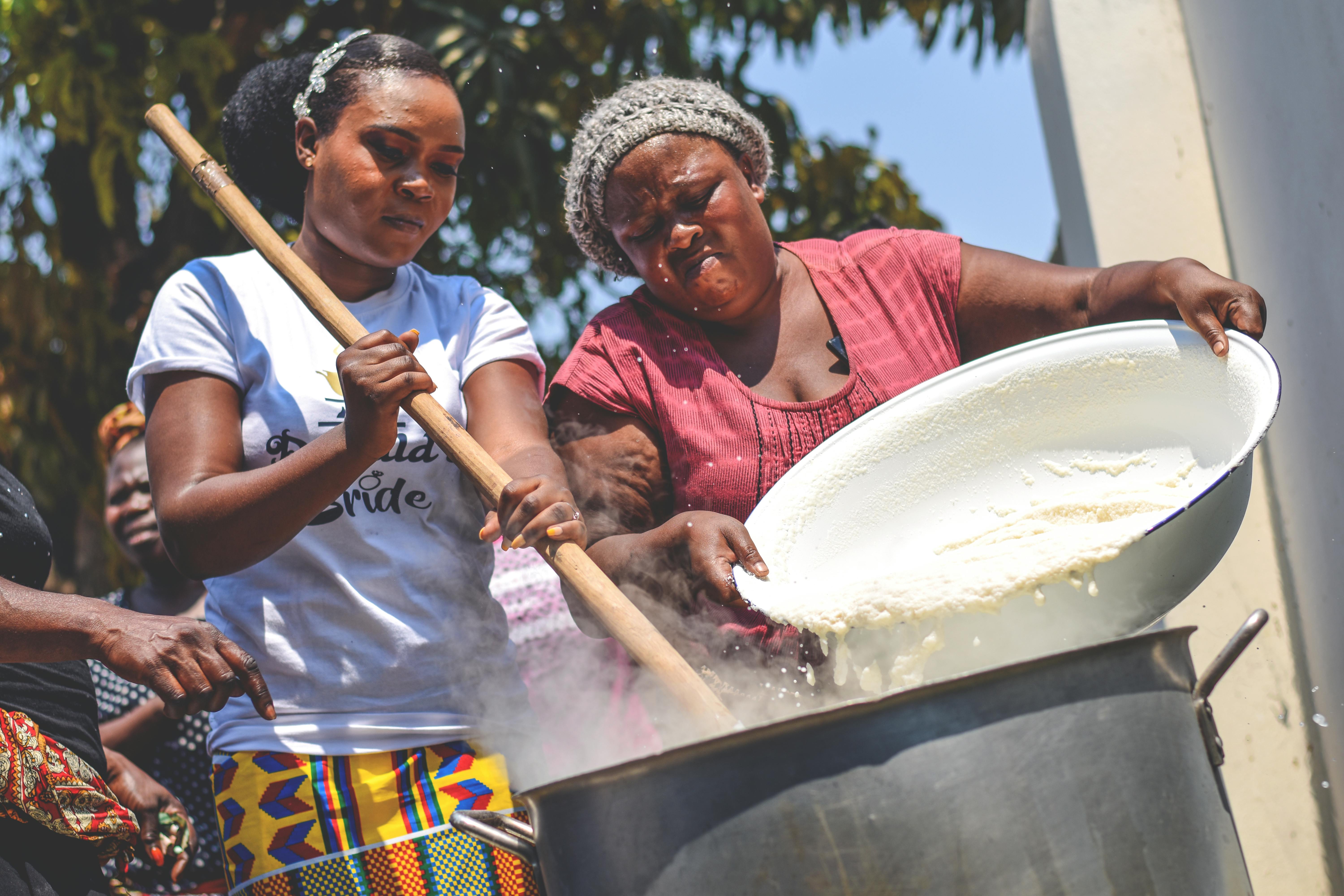 Women Cooking Outdoors · Free Stock Photo