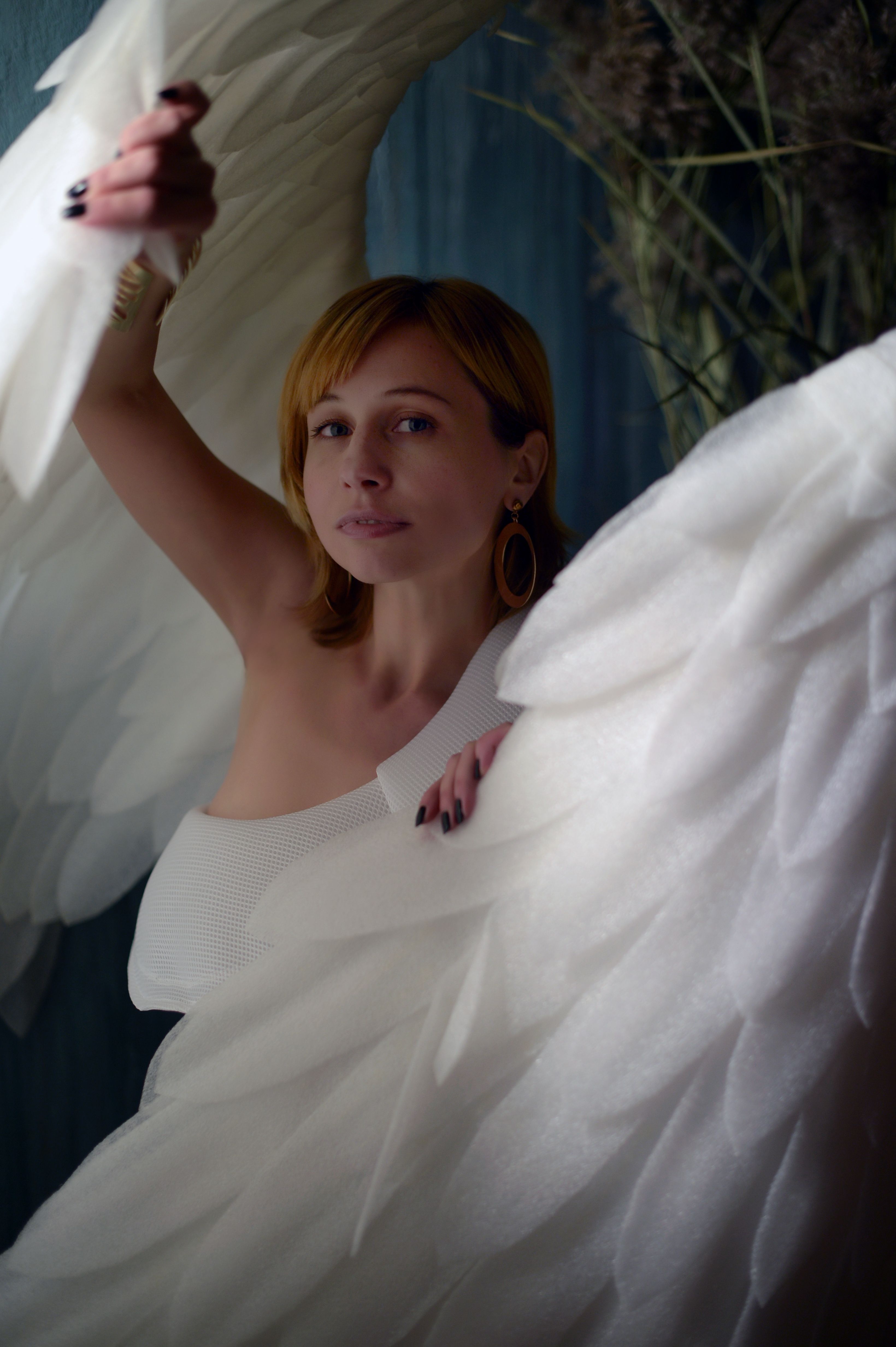 Graceful lady with angel wings looking at camera · Free Stock Photo