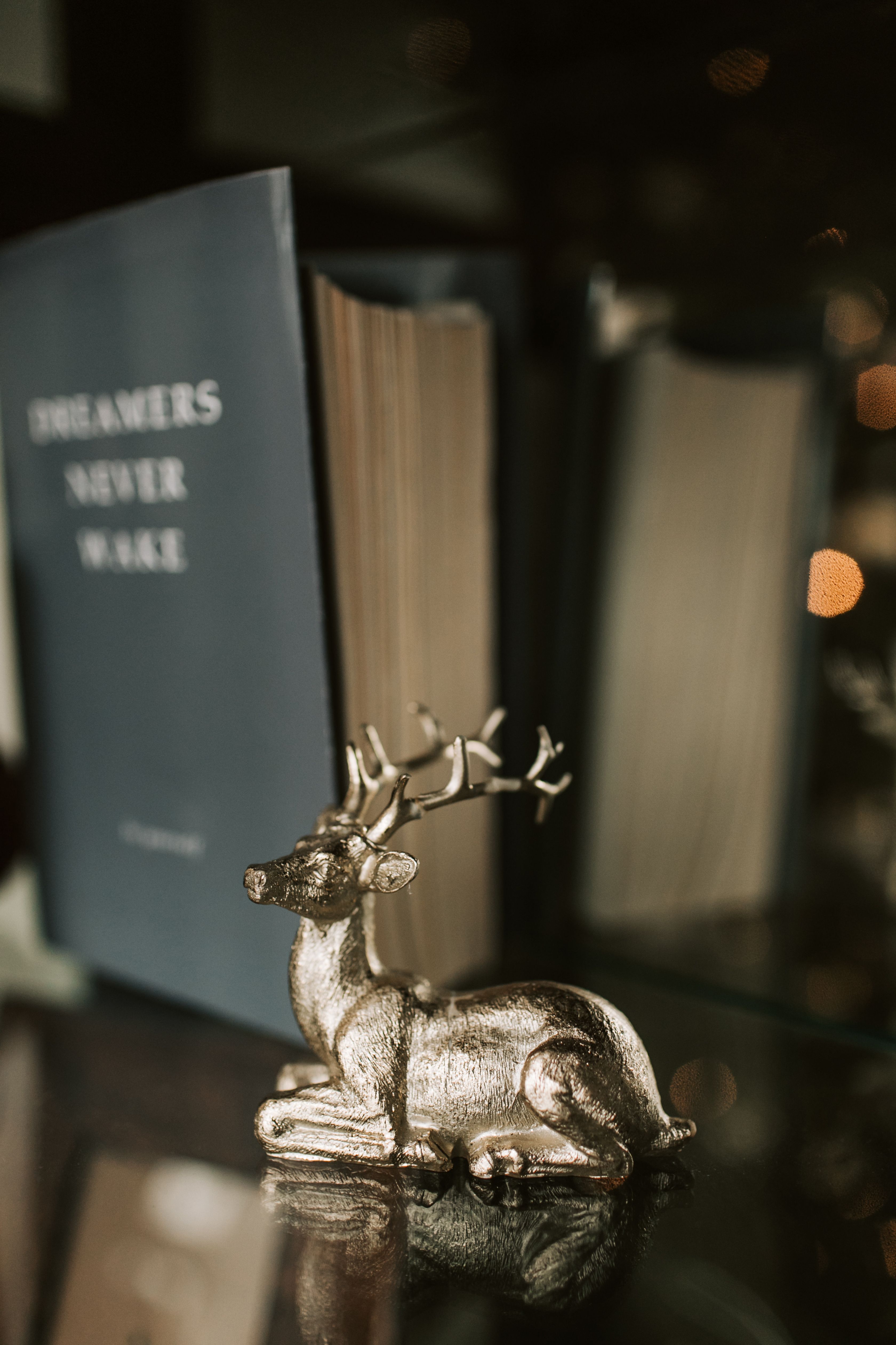 Silver Deer Figurine on the Table · Free Stock Photo