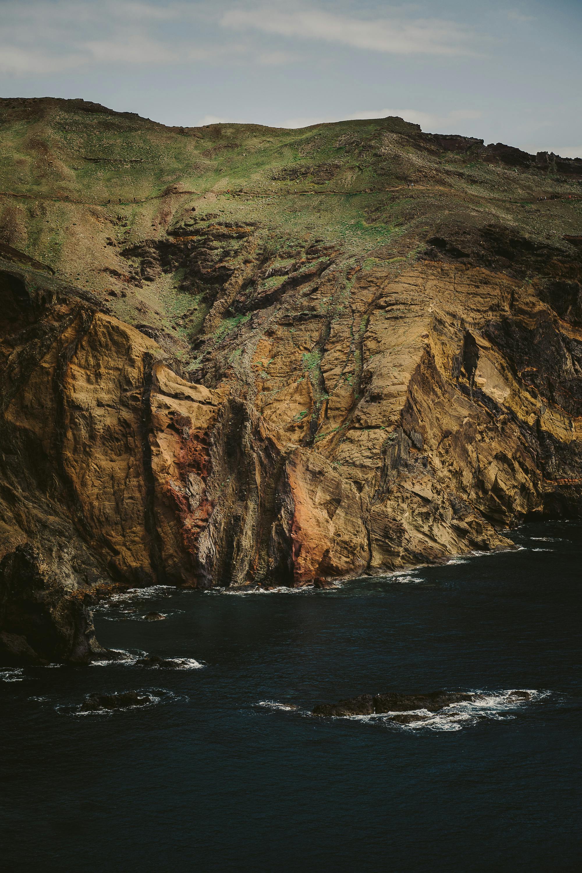Aerial Shot of Rocks in a Sea · Free Stock Photo