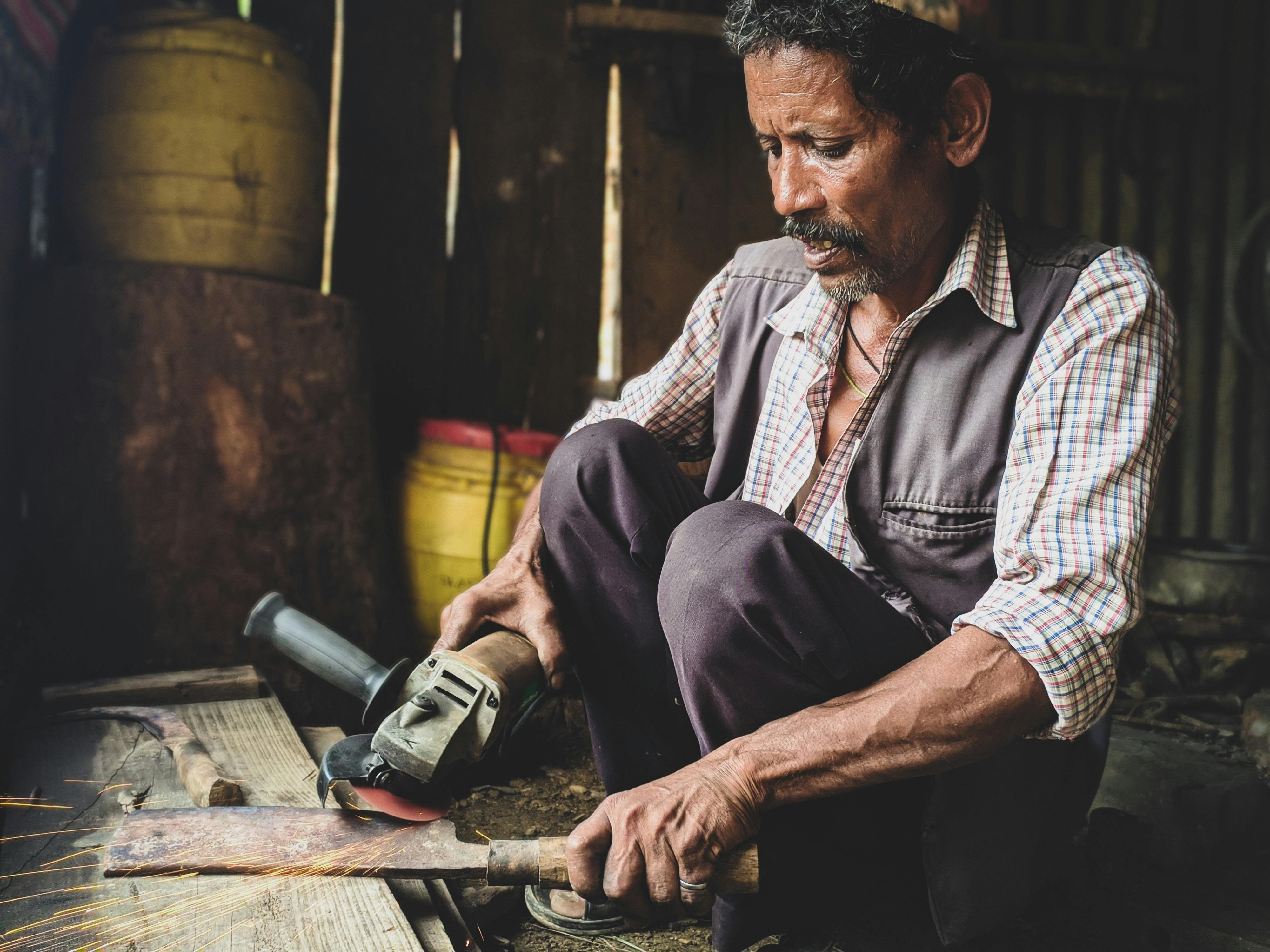 Man Crouching on Ledge · Free Stock Photo