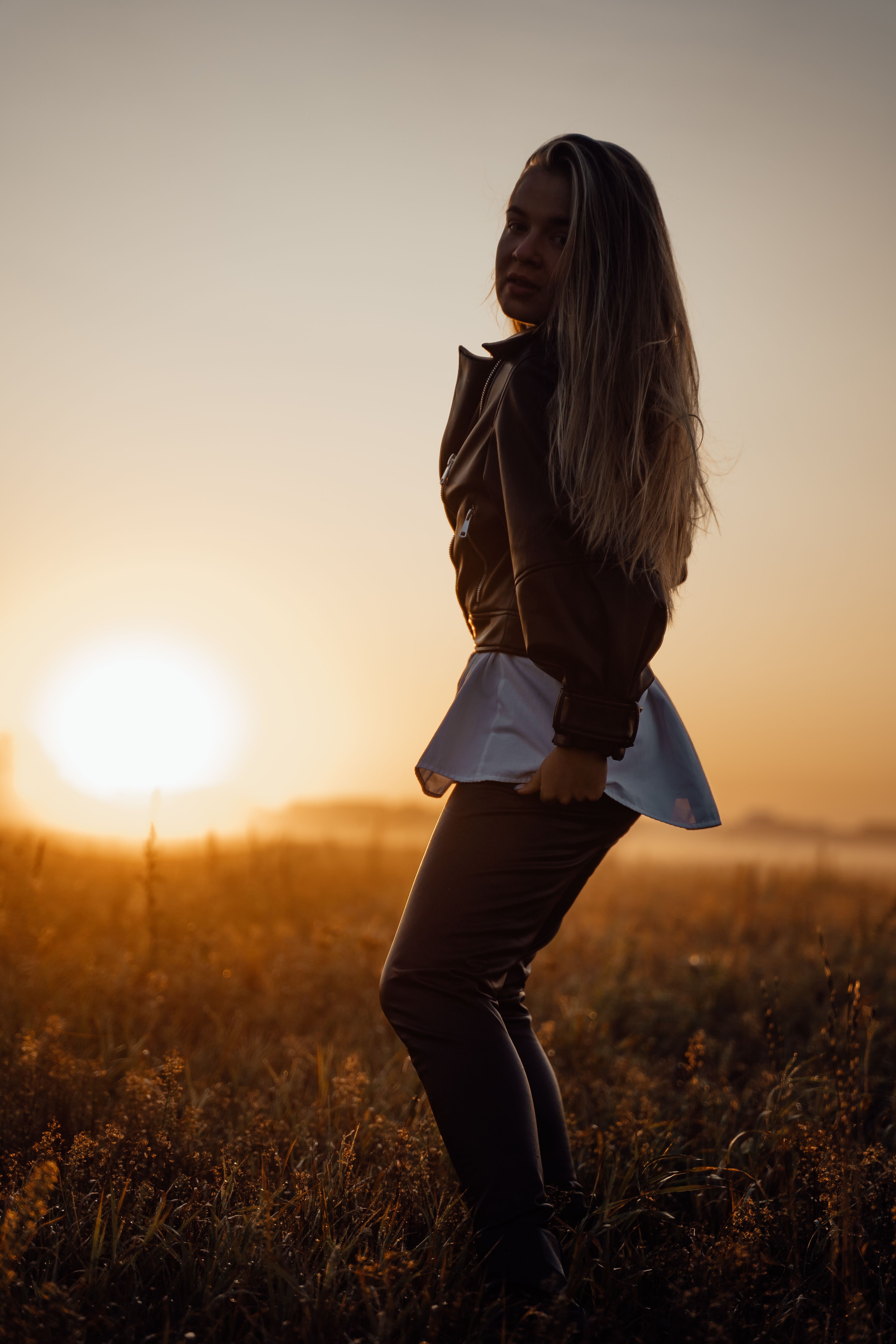 Back View of a Woman Wearing a Leather Jacket · Free Stock Photo
